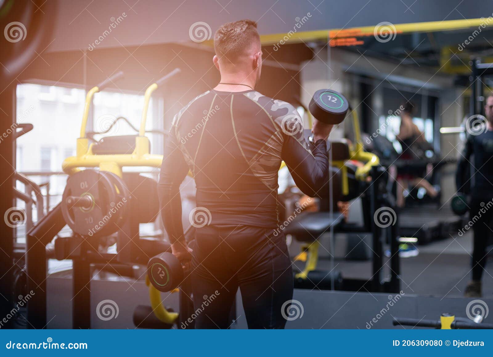 Male Athlete is Working Out at the Gym in Front of the Mirror Stock ...