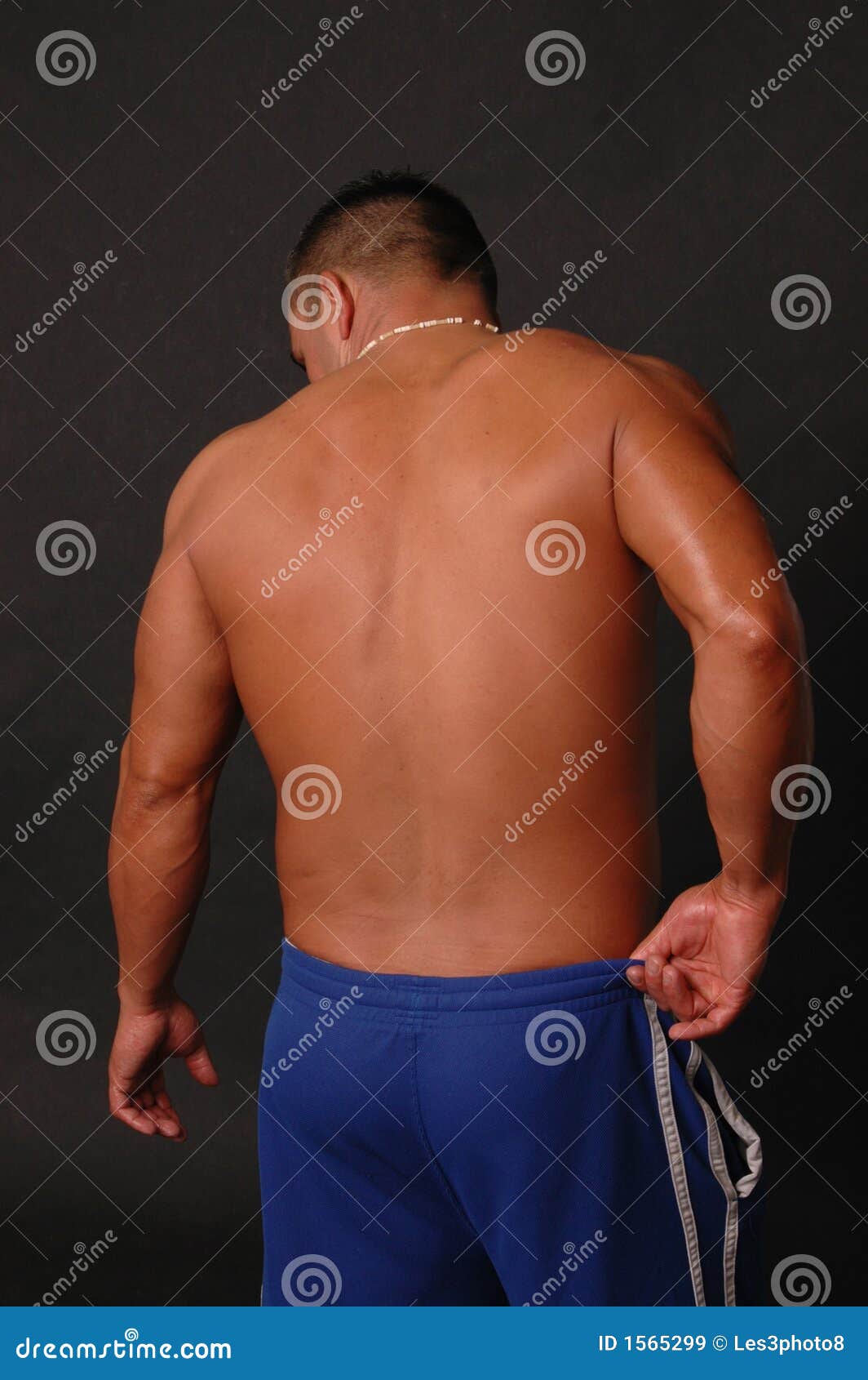 Male back in blue sweats stock image. Image of male, back - 1565299