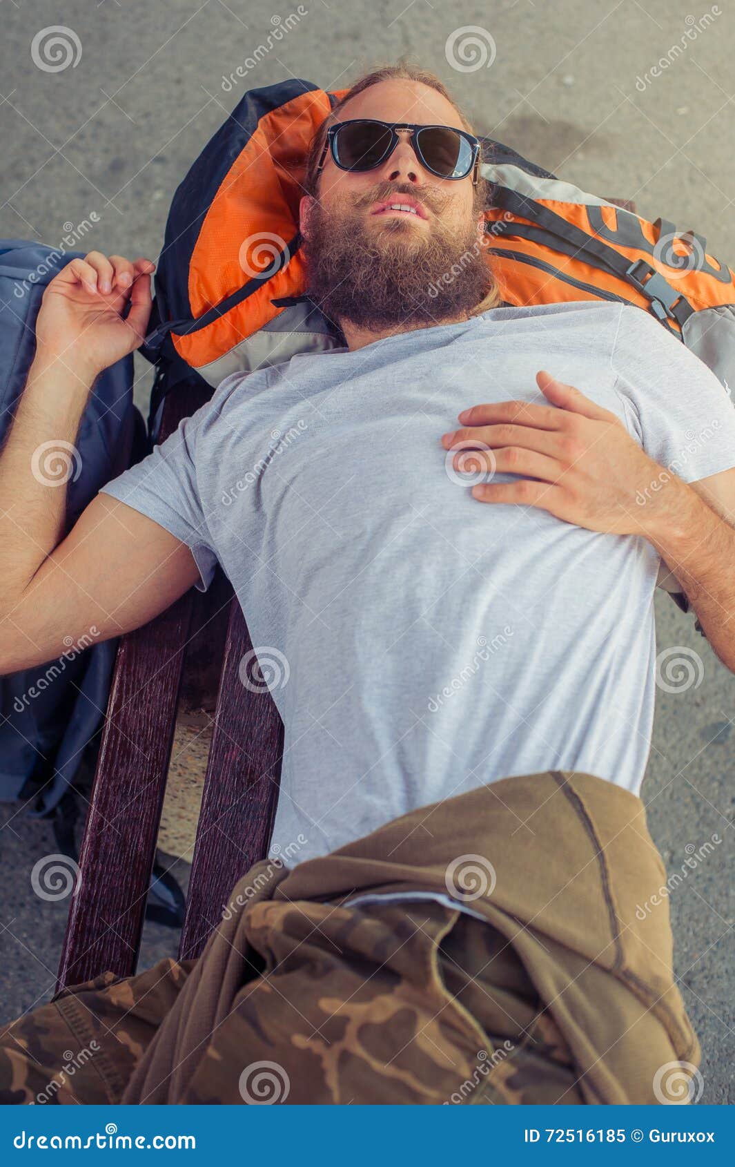 Male Backpacker Tourist Napping on a Bench Stock Image - Image of ...