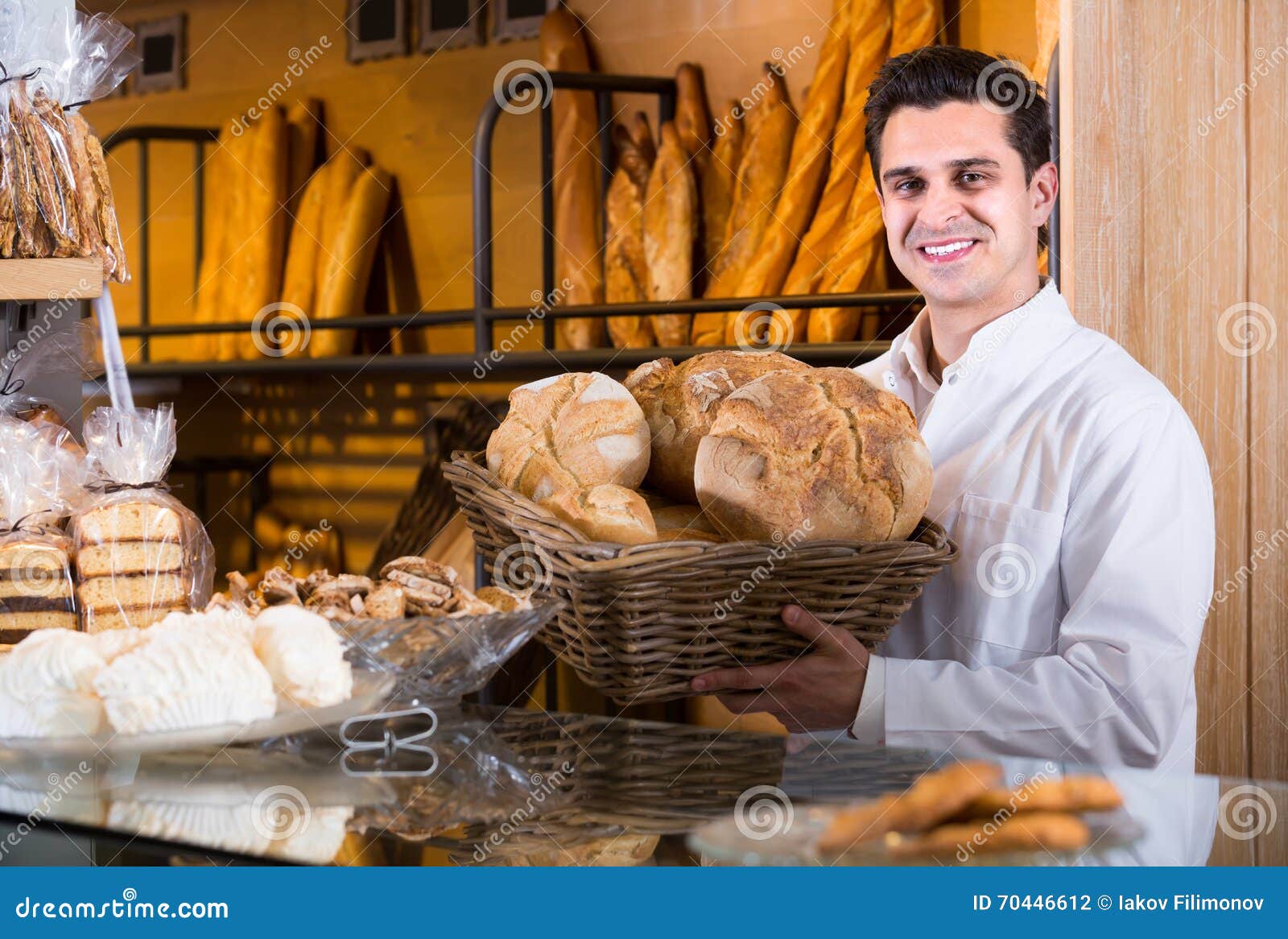 Male baker at bakery stock photo. Image of offering, counter - 70446612