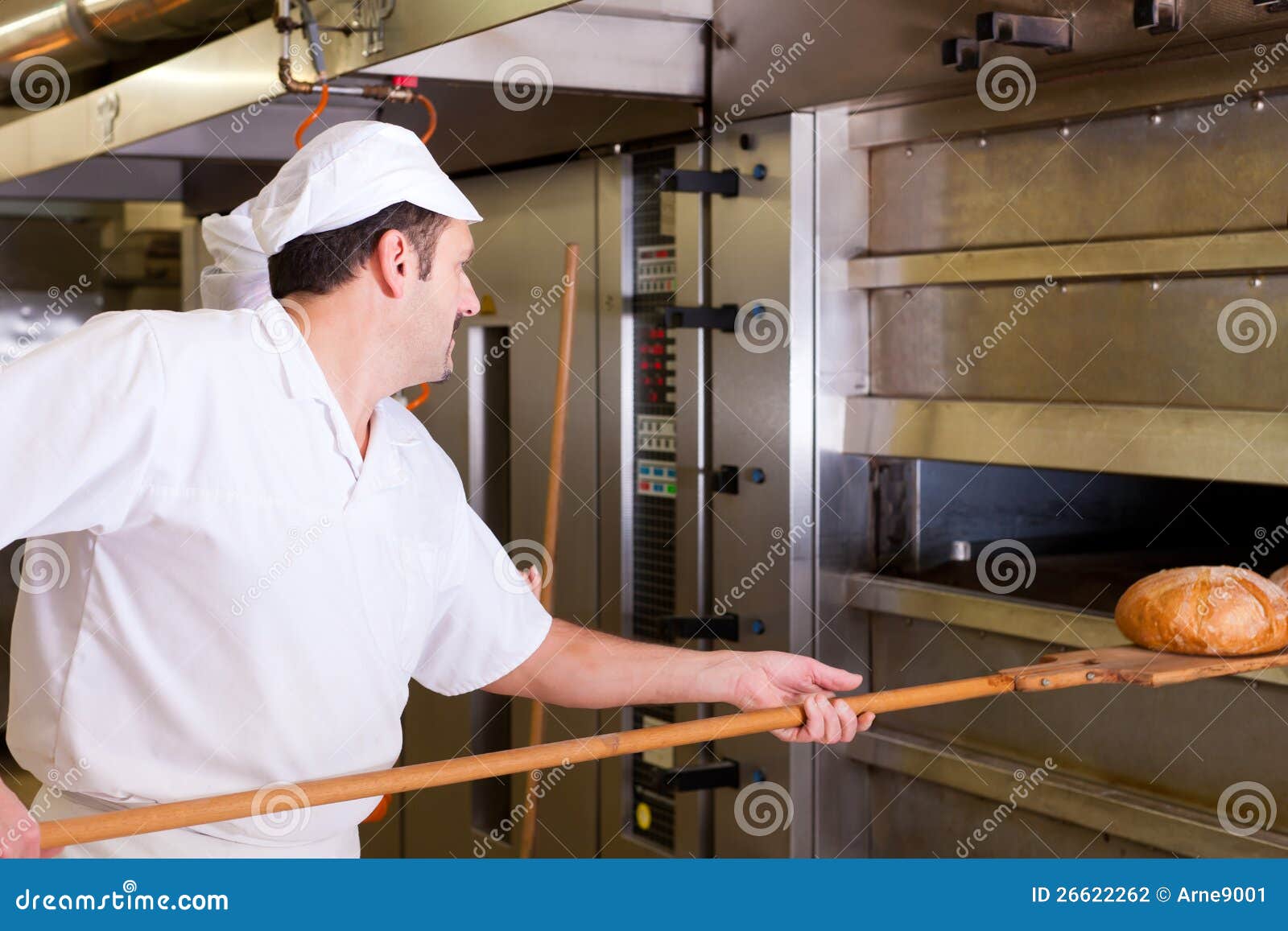 Male baker baking bread stock photo. Image of products - 26622262