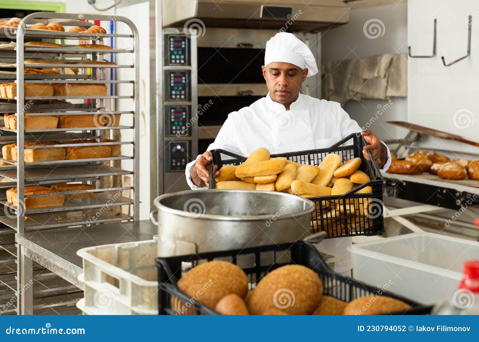 Male Baker with Box of Bread at Bakery Stock Photo - Image of ...