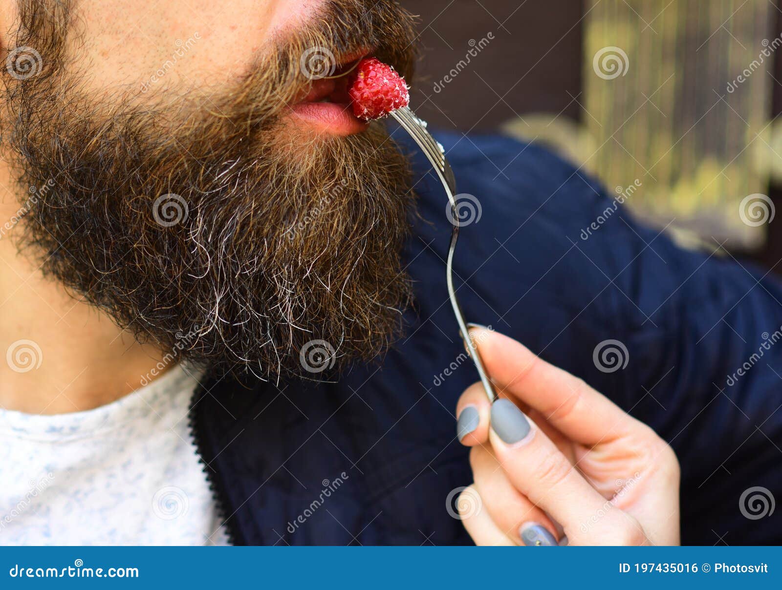 Male with Beard Eats Raspberry on Blurred Background Stock Photo ...