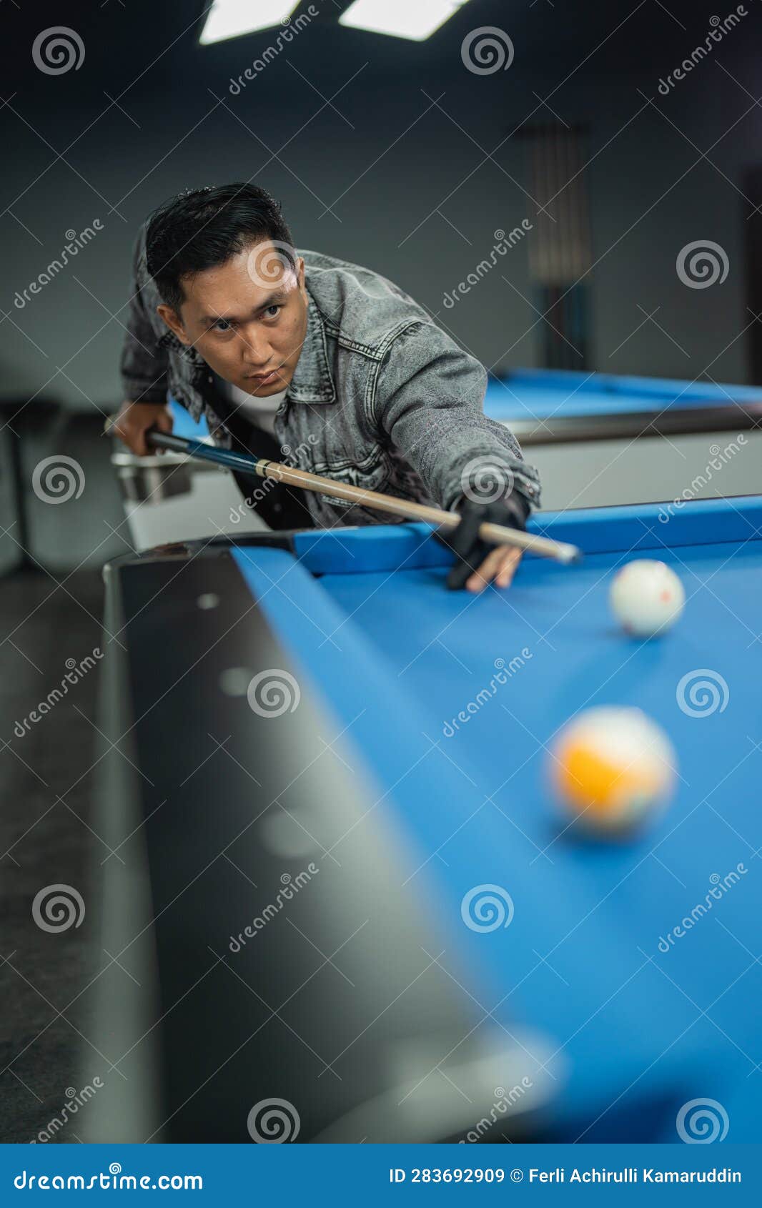 Male Billiard Player Poking the Ball Seriously Using the Cue Stick ...
