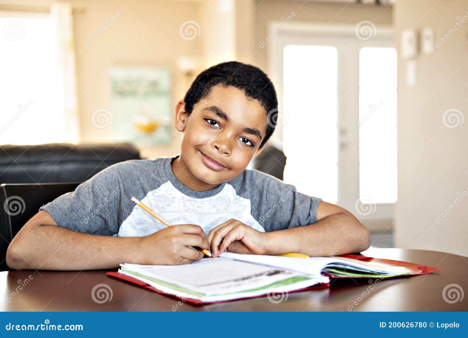 A Male Black Child Doing Homework at Home Stock Photo - Image of ...