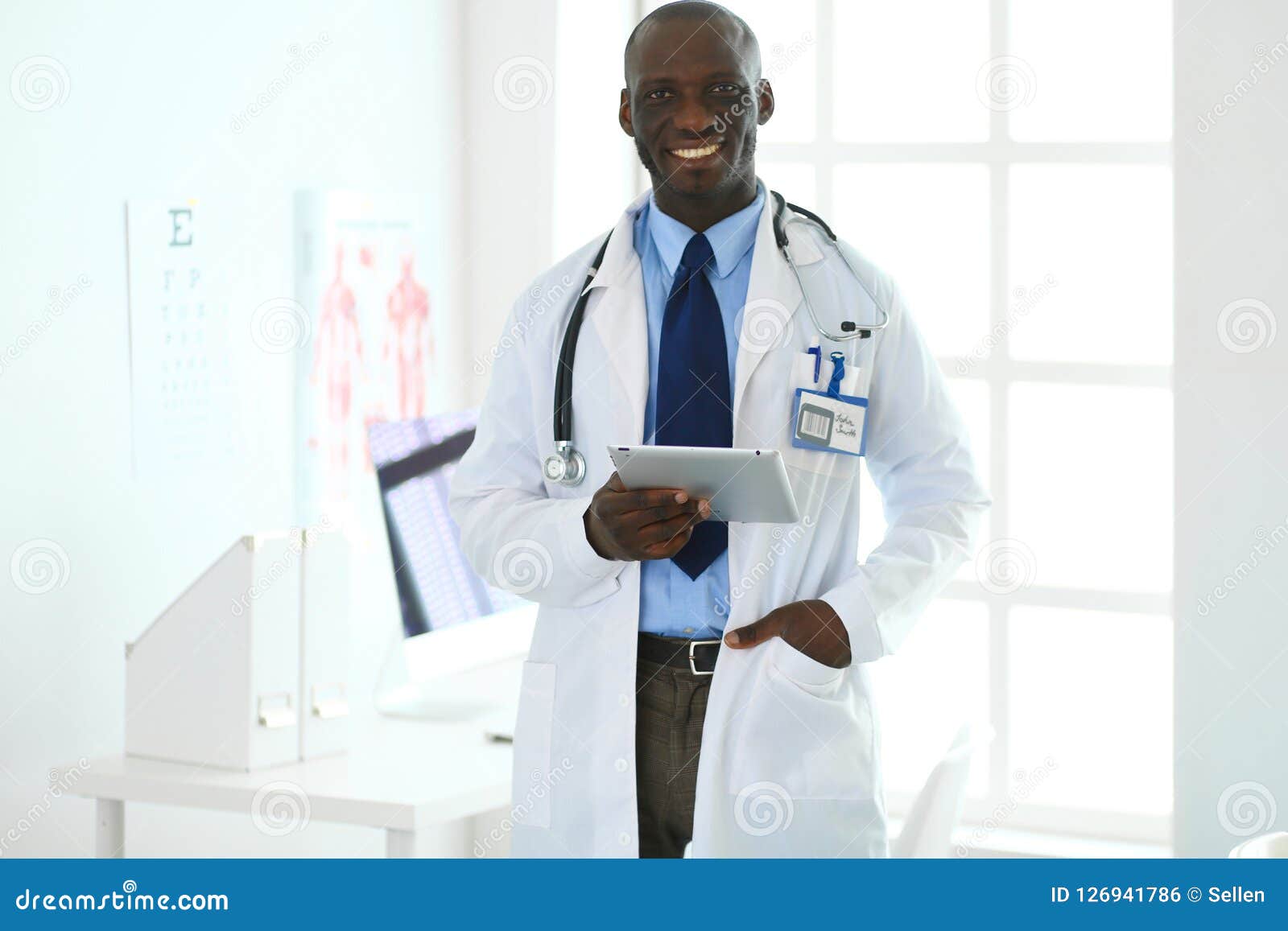 Male Black Doctor Worker with Tablet Computer Standing in Hospital ...