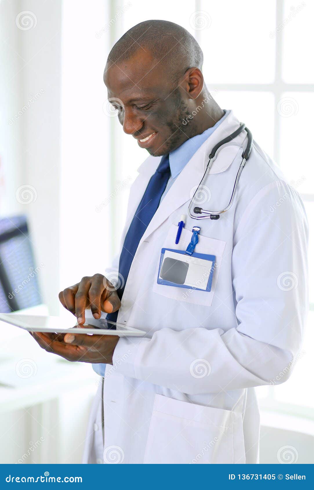 Male Black Doctor Worker with Tablet Computer Standing in Hospital ...