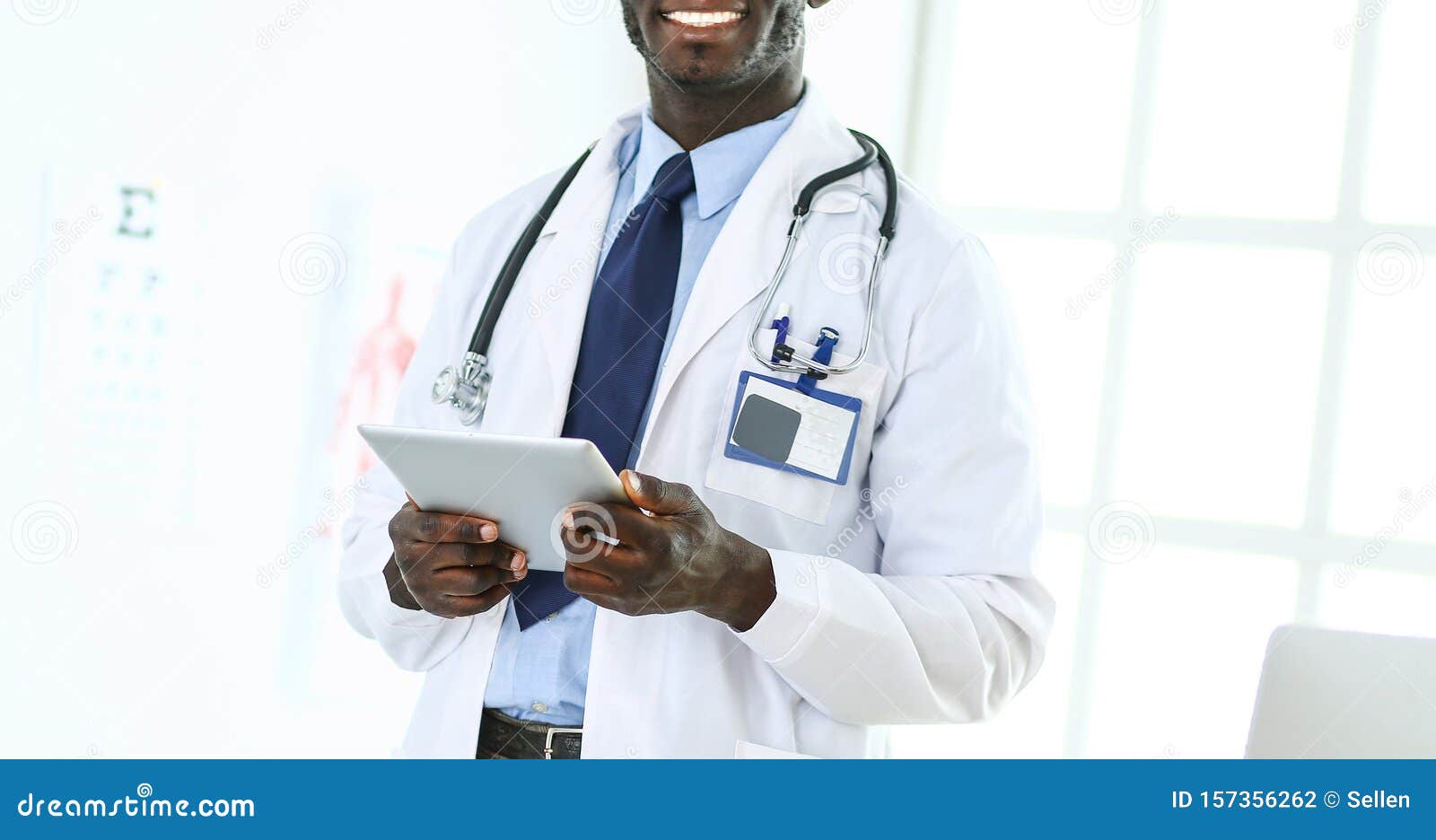 Male Black Doctor Worker with Tablet Computer Standing in Hospital ...