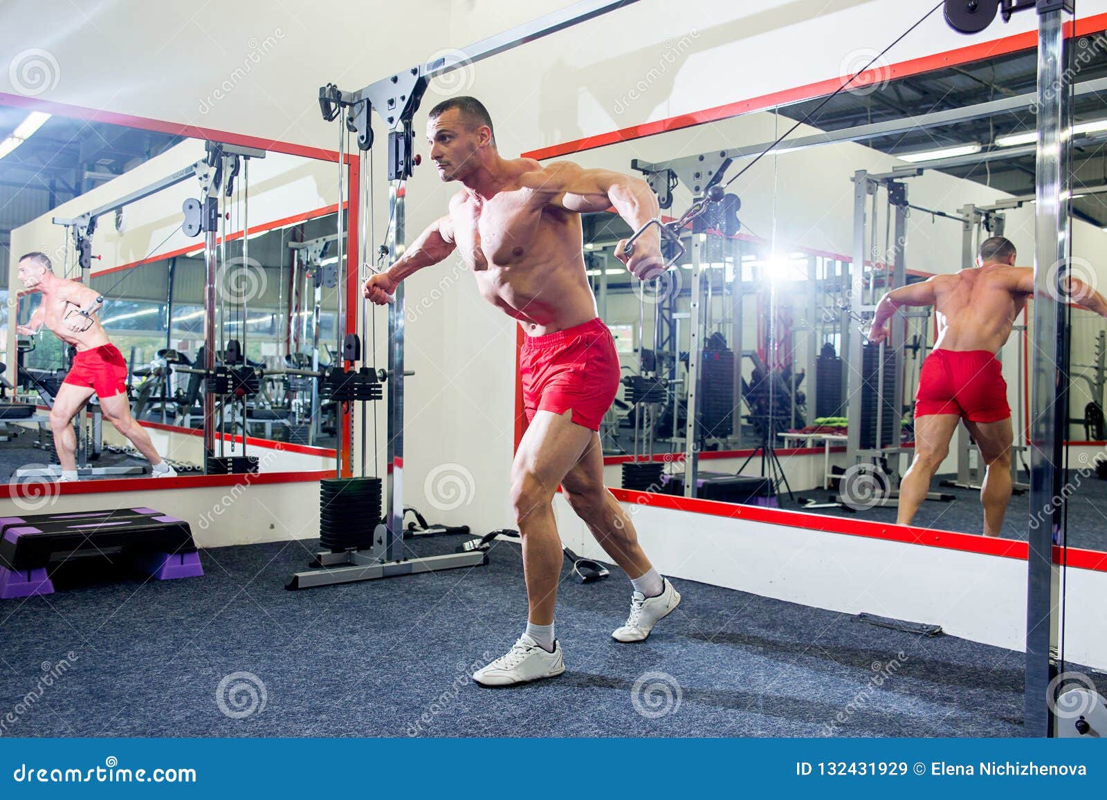 Male Bodybuilder Doing Exercises in a Gym Stock Image - Image of ...