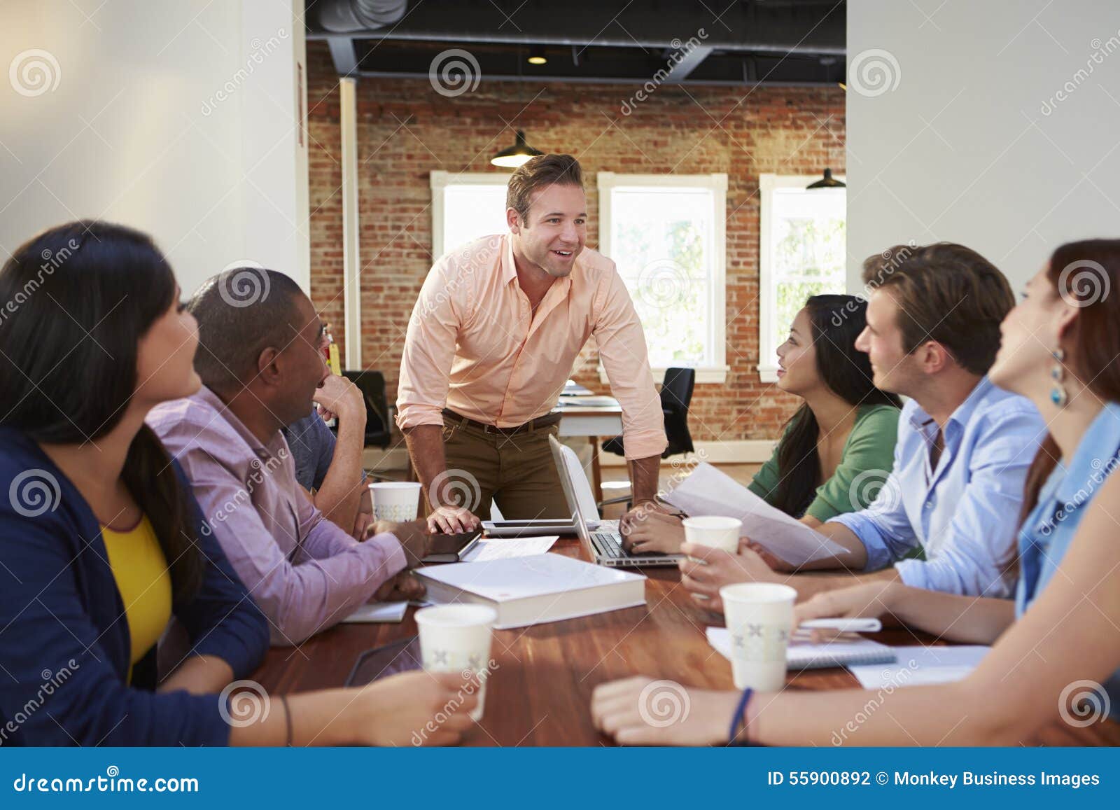 Male Boss Addressing Office Workers at Meeting Stock Photo - Image of ...