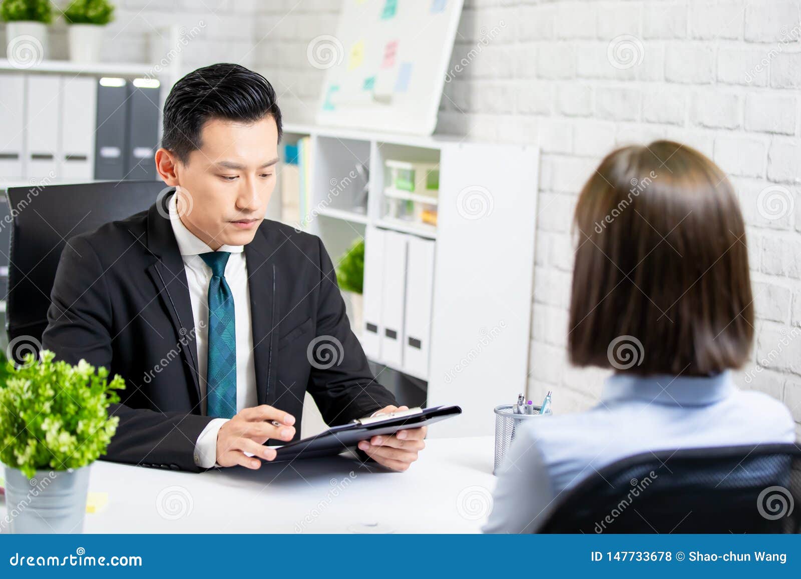 Male Boss Addressing Office Workers At Meeting Royalty-Free Stock ...