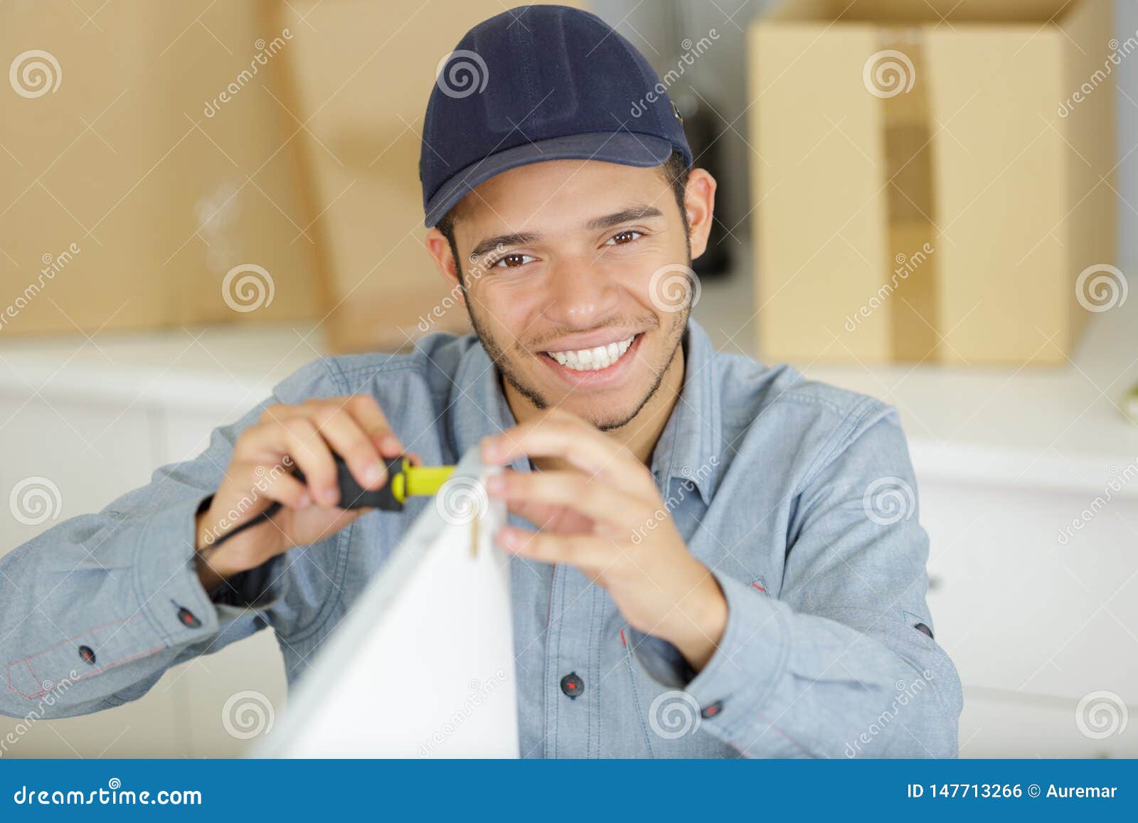 Male Builder Fixing Cupboard Stock Photo - Image of mending, overhaul ...