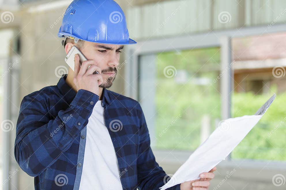 Male Builder Foreman Talking on Cell Phone Stock Image - Image of ...