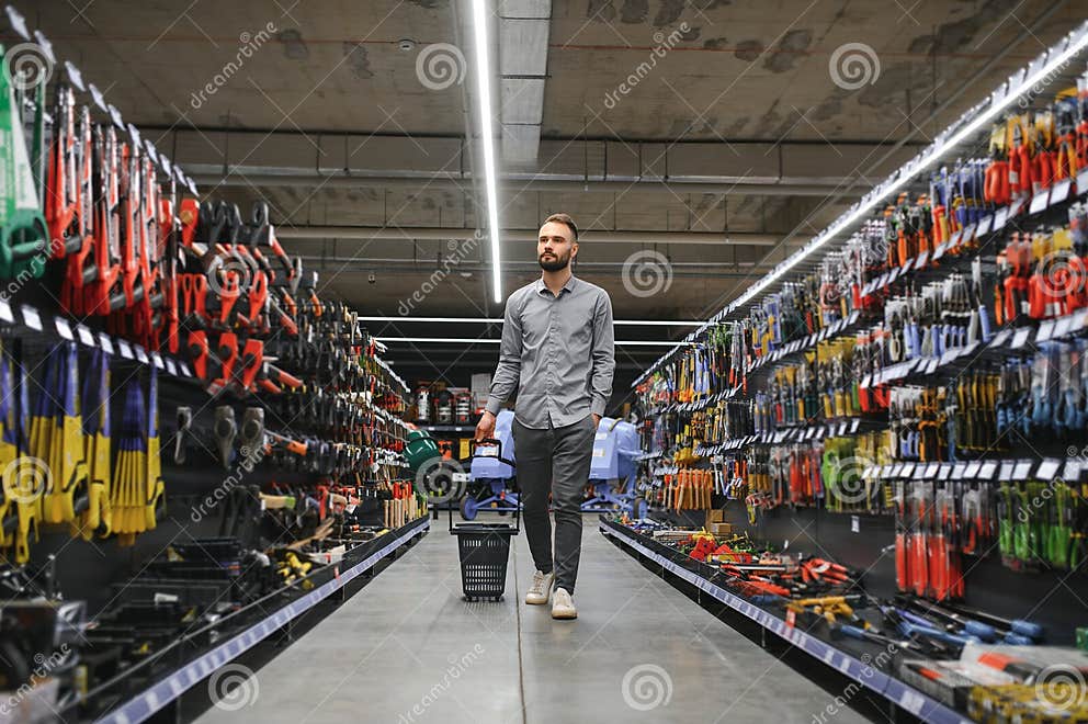 Male Builder in a Hardware Store Stock Photo - Image of shop, tool ...