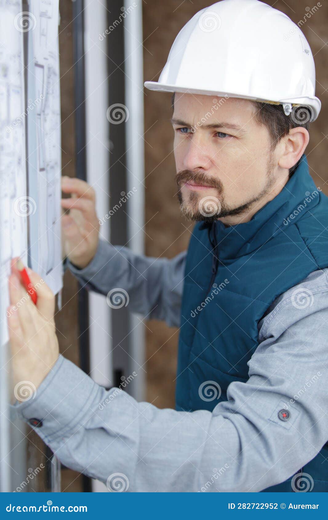 Male Builder with Helmet Writing on Wall Stock Photo - Image of back ...