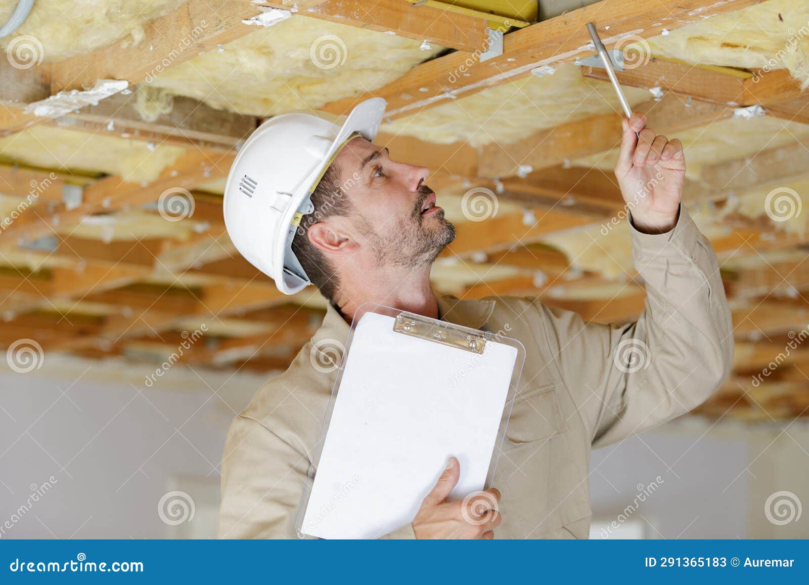 Male Builder Inspecting Ceiling Construction Site Stock Image - Image ...