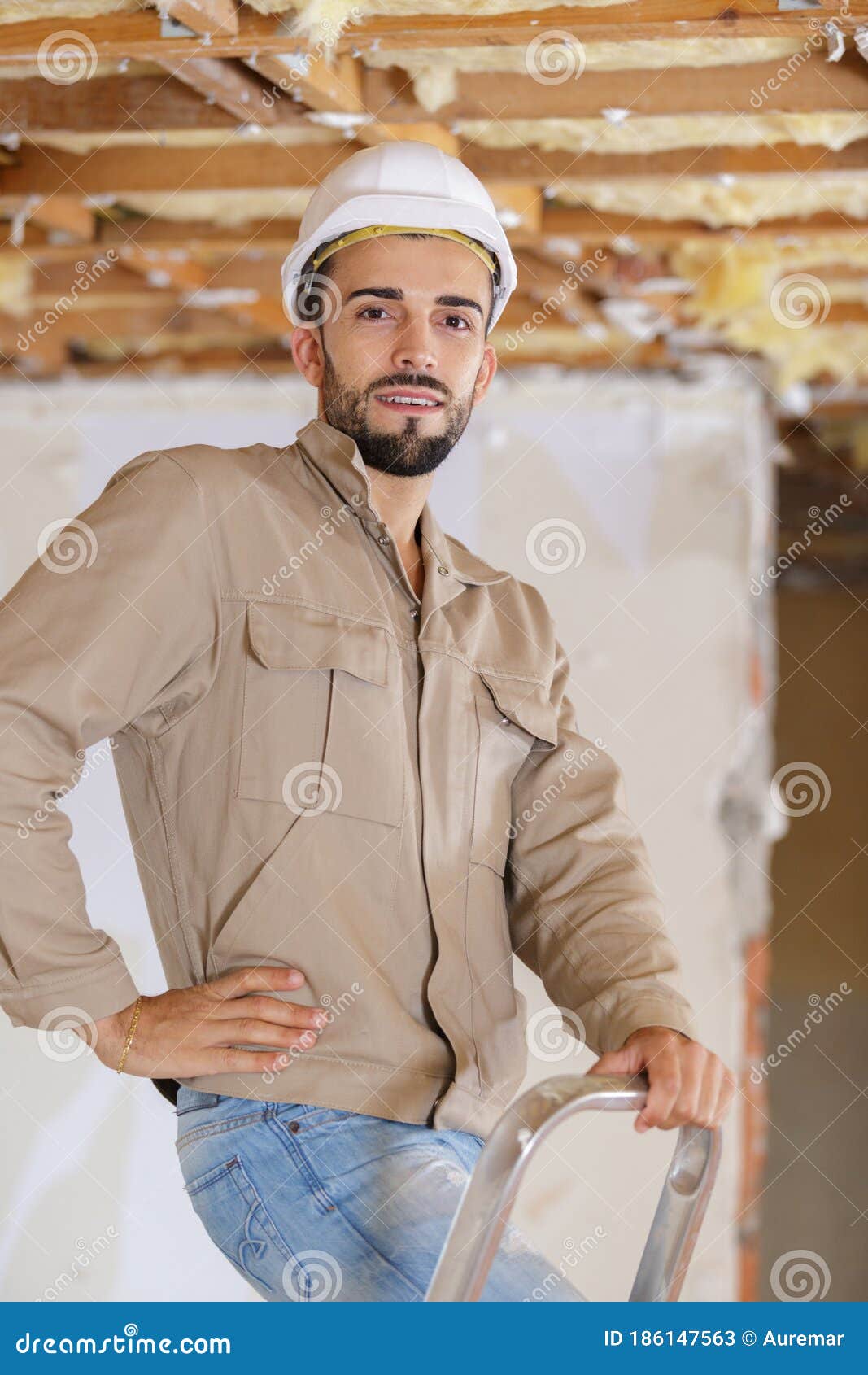 Male Builder in Ladder Looking at Camera Stock Image - Image of ...