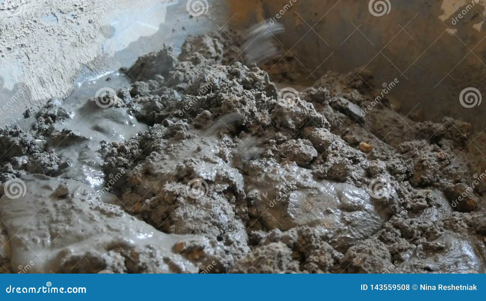 Male Builder Making Cement. Blends Cement Clay and Water, Mixing All it ...