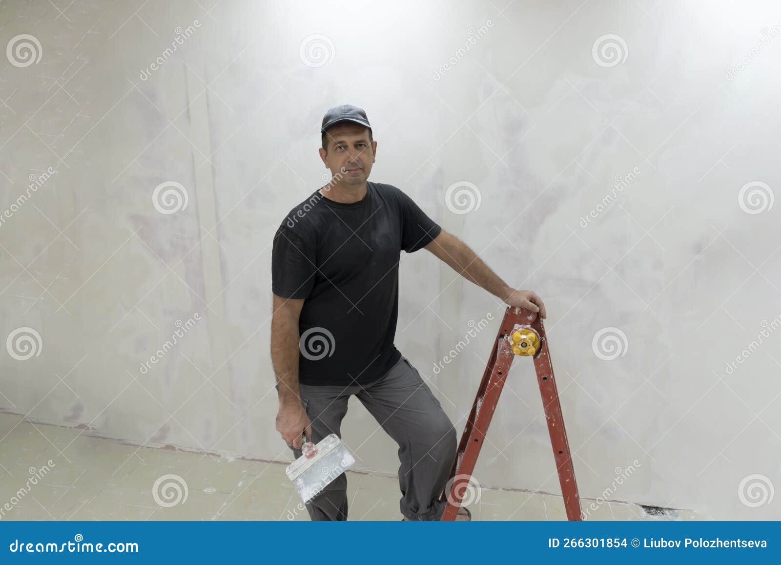 Male Builder, Master Office, Plasterer with a Tool in Working Clothes ...
