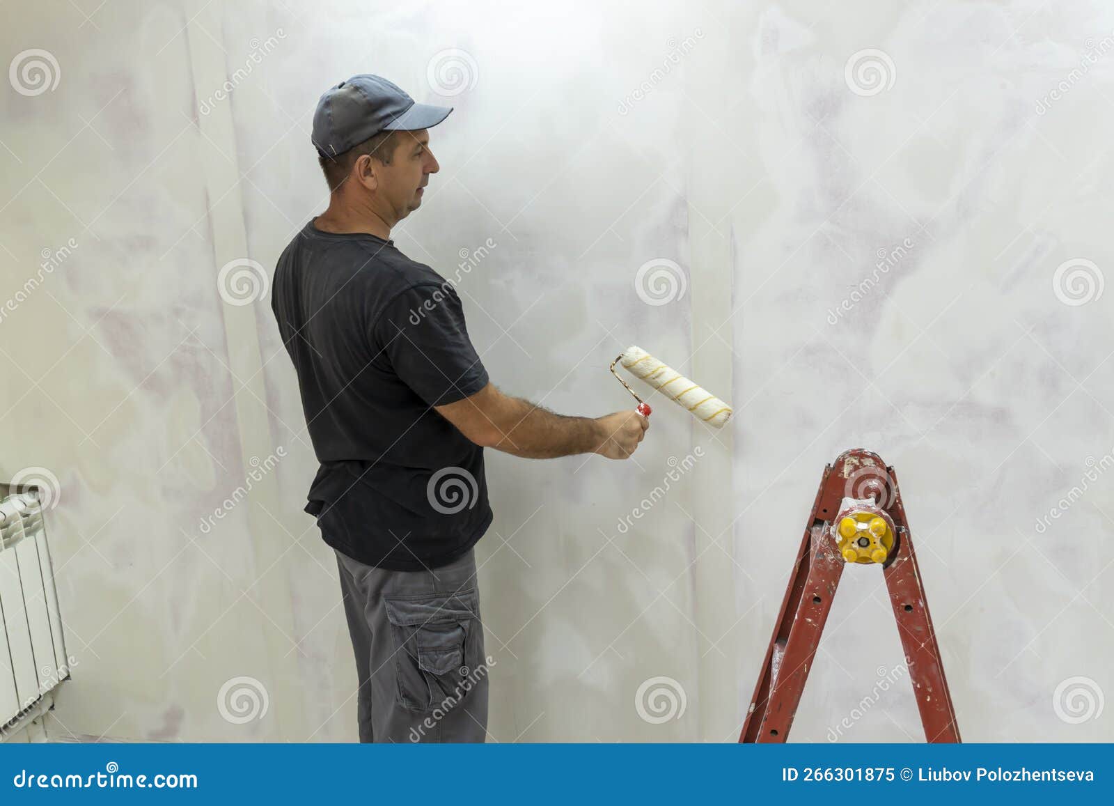 Male Builder, Master Office, Plasterer with a Tool in Working Clothes ...