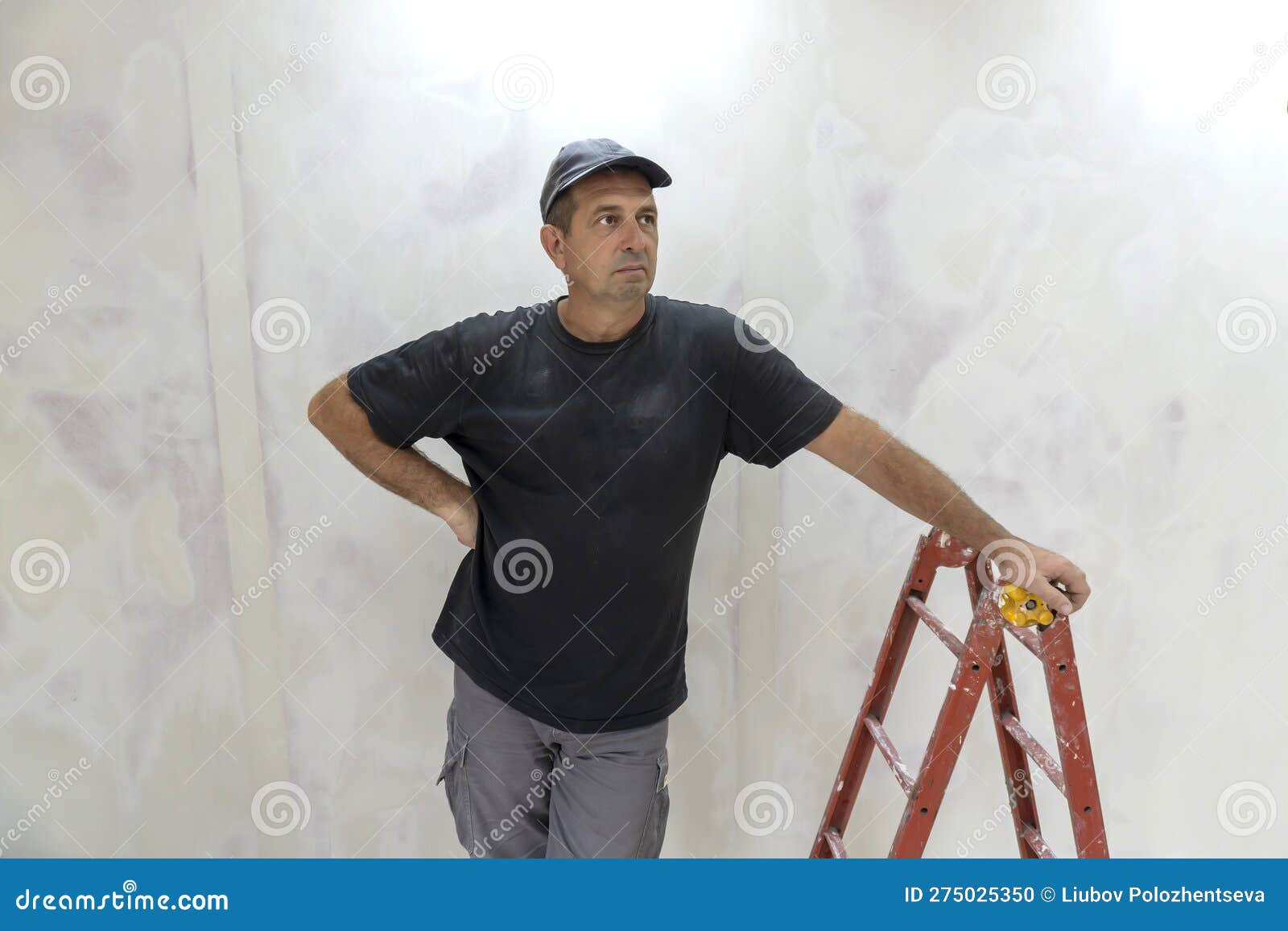 Male Builder, Master Office, Plasterer with a Tool in Working Clothes ...