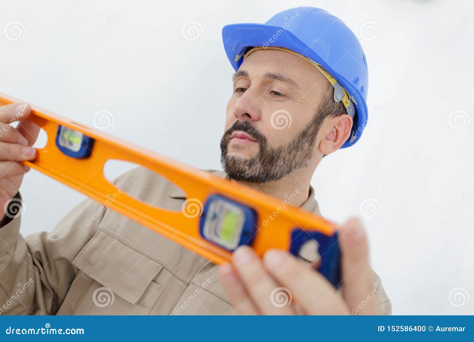 Male Builder Measuring Wall Stock Photo - Image of renovation, bookworm ...