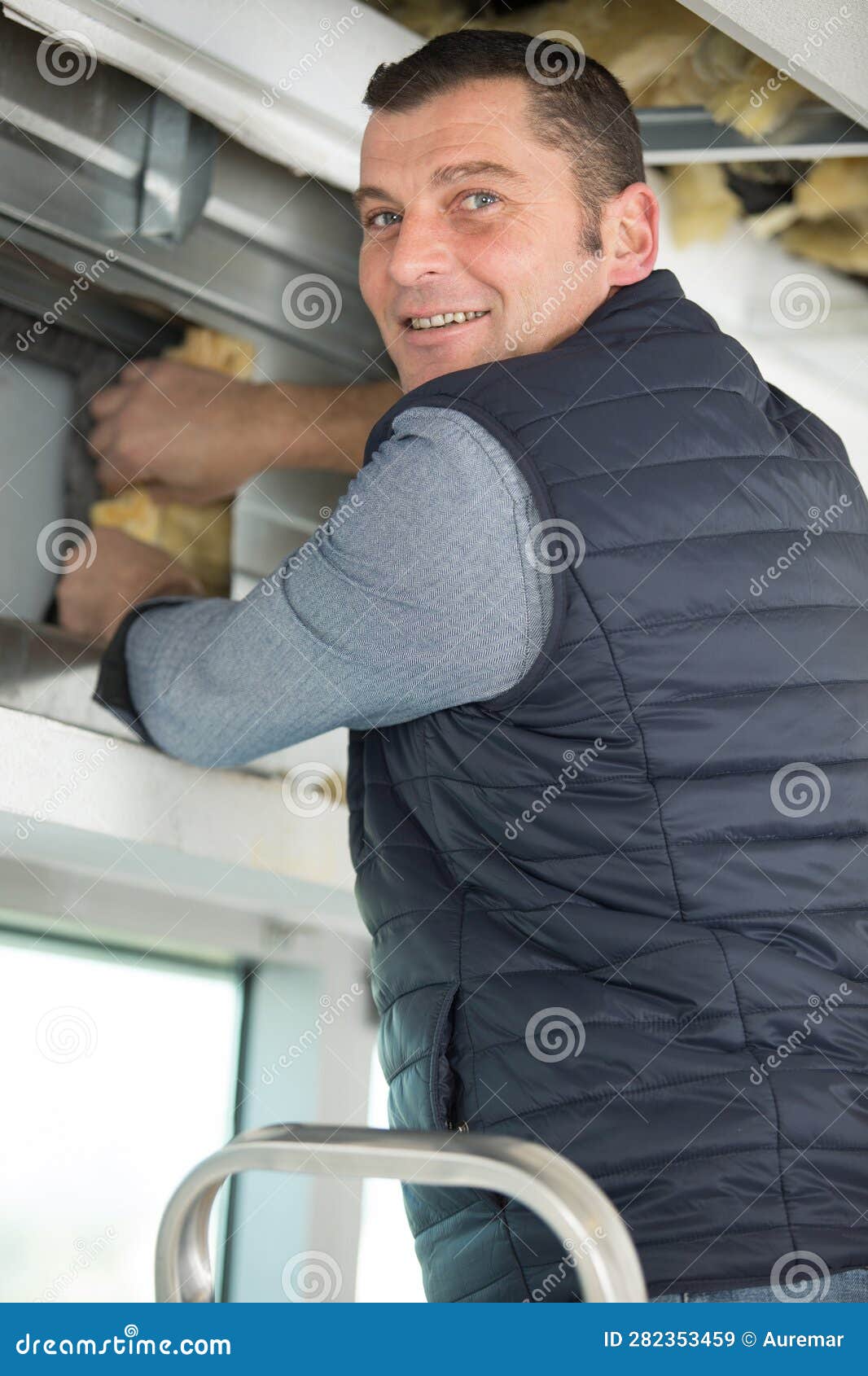 Male Builder Packing Insulation into Wall Cavity Stock Image - Image of ...