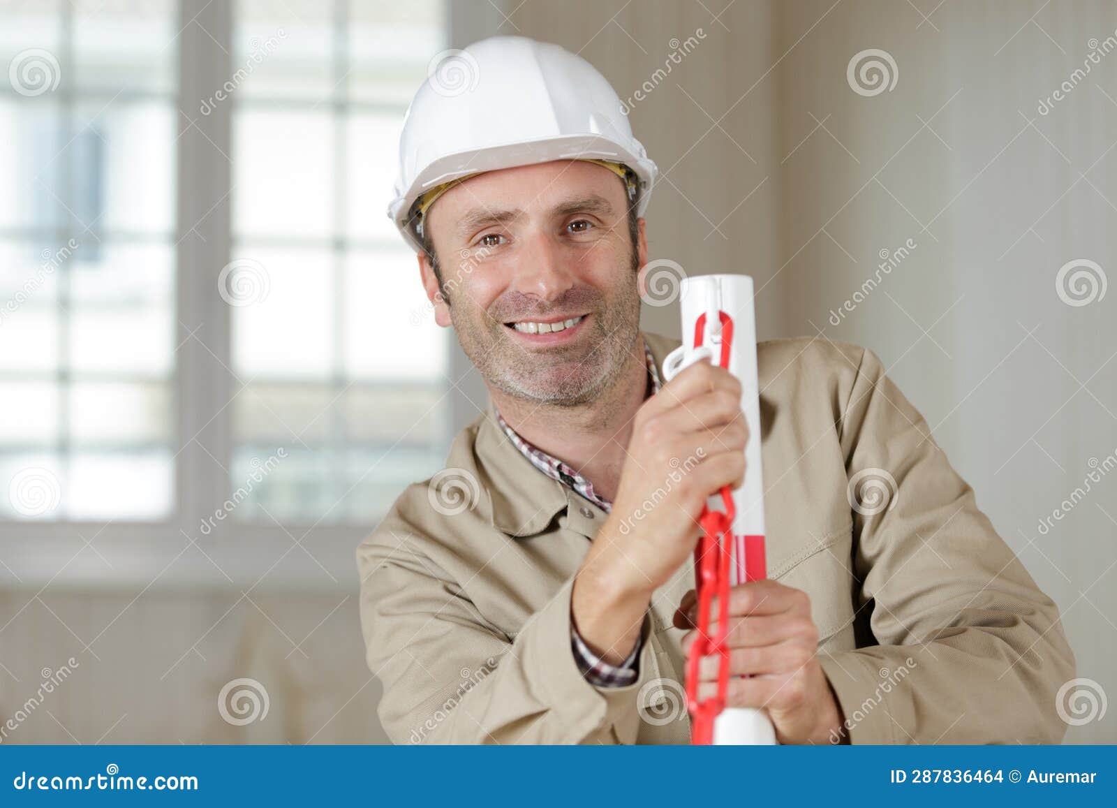 Male Builder Setting Up Safety Chain Stock Photo - Image of guard ...