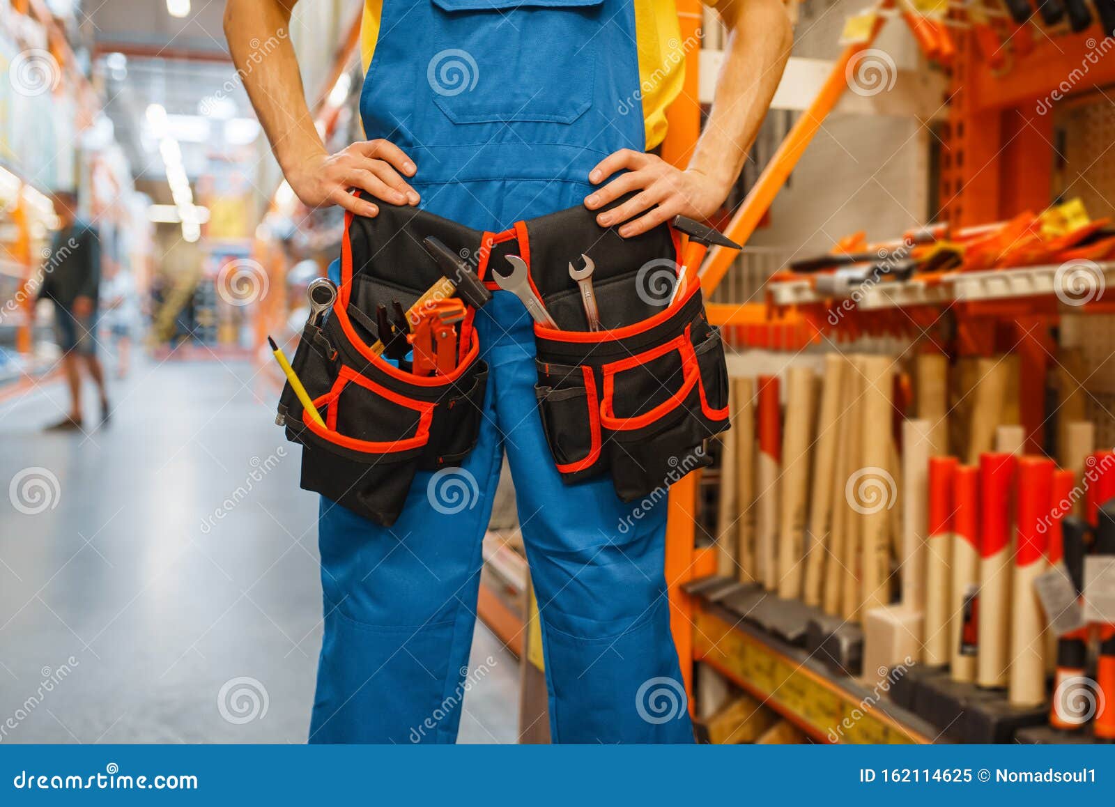 Male Builder Trying on Tool Belt in Hardware Store Stock Image - Image ...