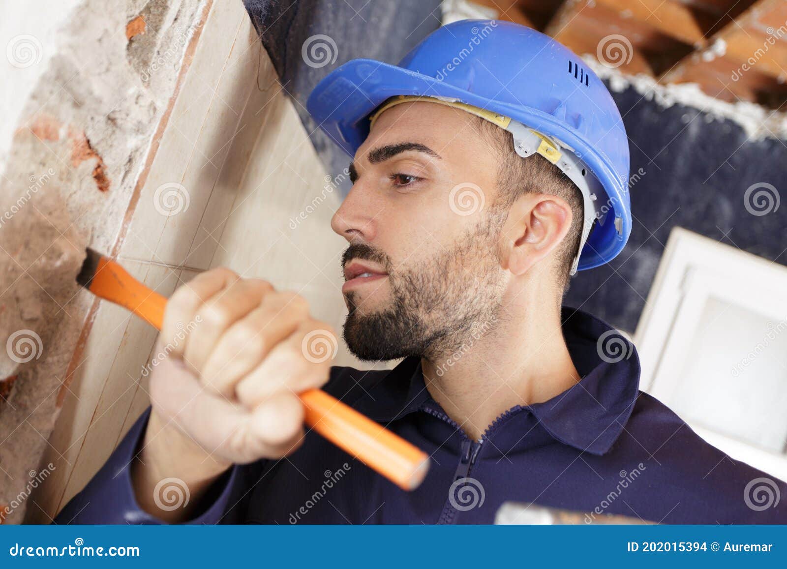 Male Builder Using Hammer Chisel on Interior Wall Stock Photo - Image ...