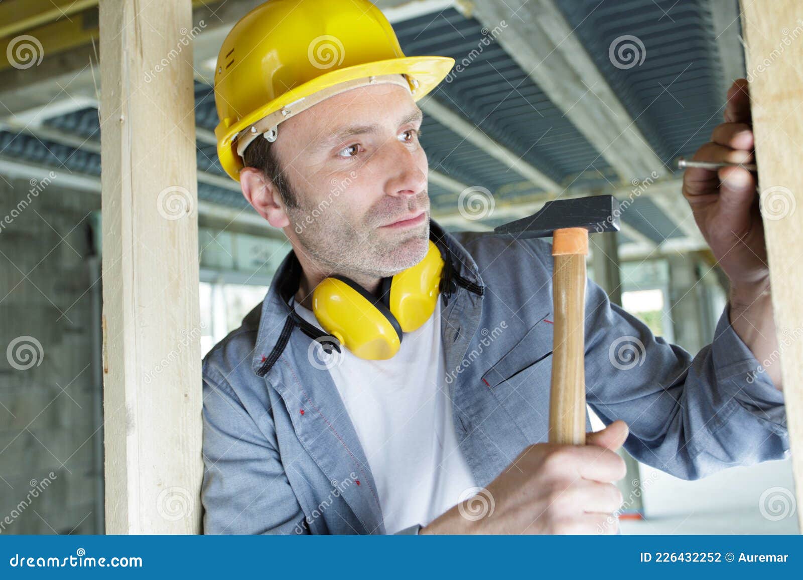 Male Builder Using Hammer with Nails Stock Photo - Image of black ...