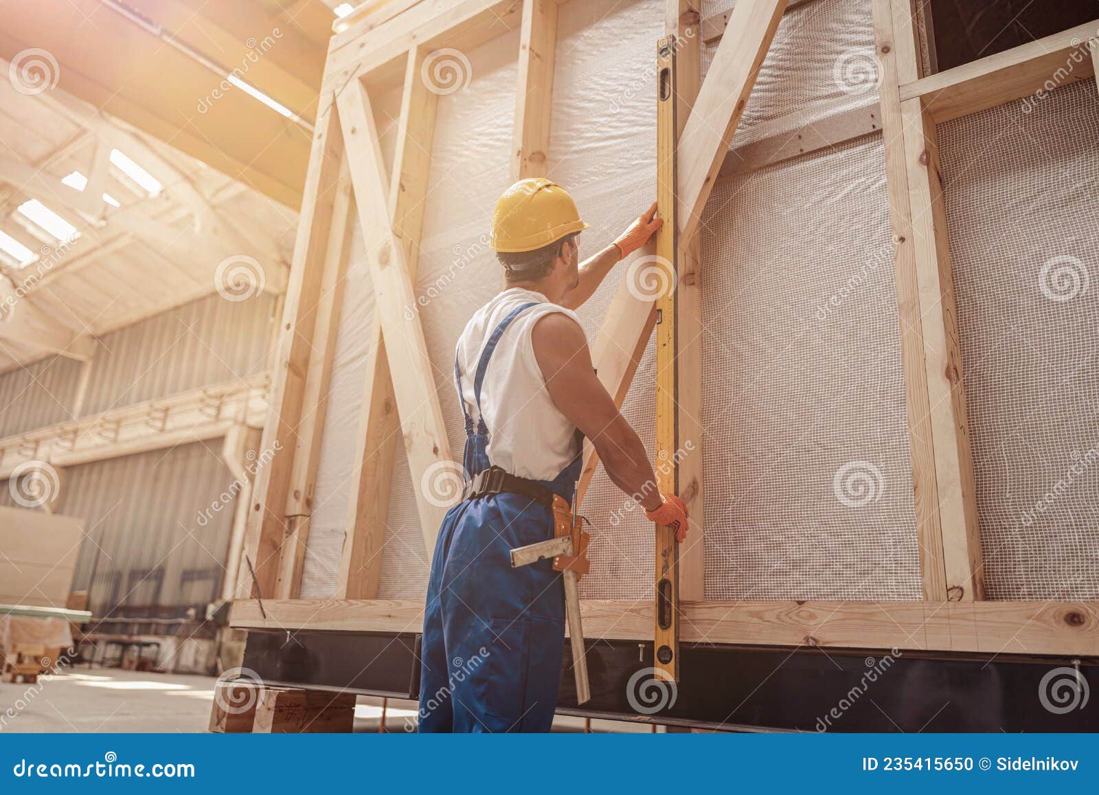 Male Builder in Work Overalls Working at Construction Site Stock Photo ...