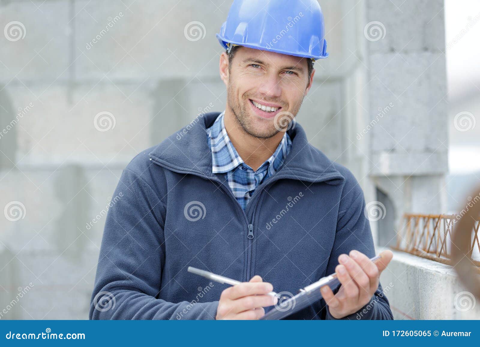 Male Builder Writing on Clipboard Stock Image - Image of order ...