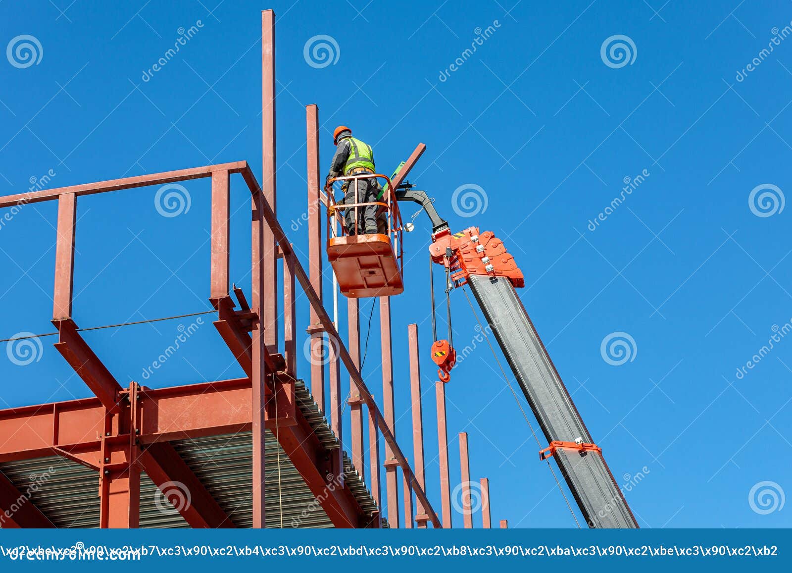 Male Builders Work at Height in a Lifting Cradle, Creating the Iron ...