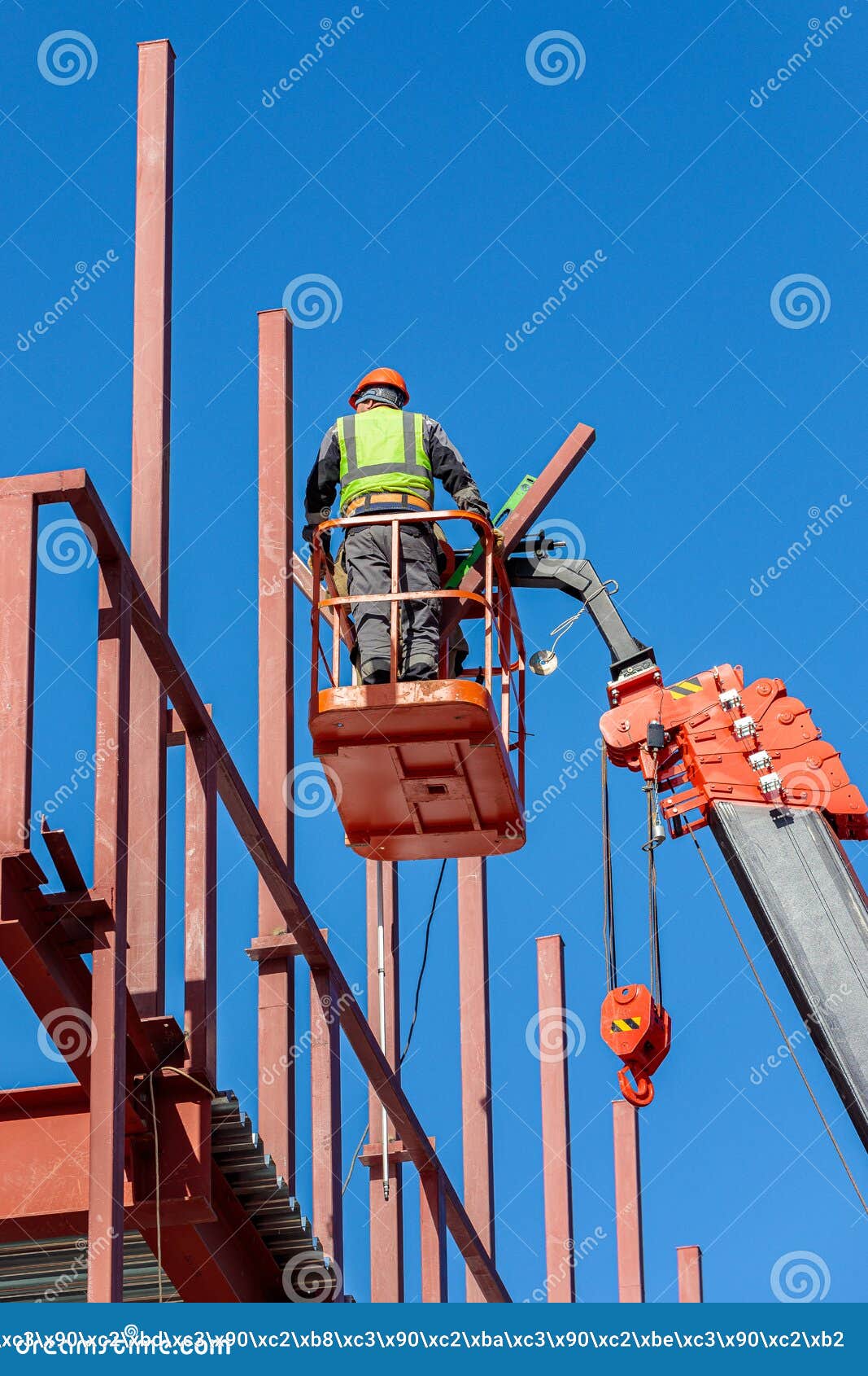 Male Builders Work at Height in a Lifting Cradle, Creating the Iron ...