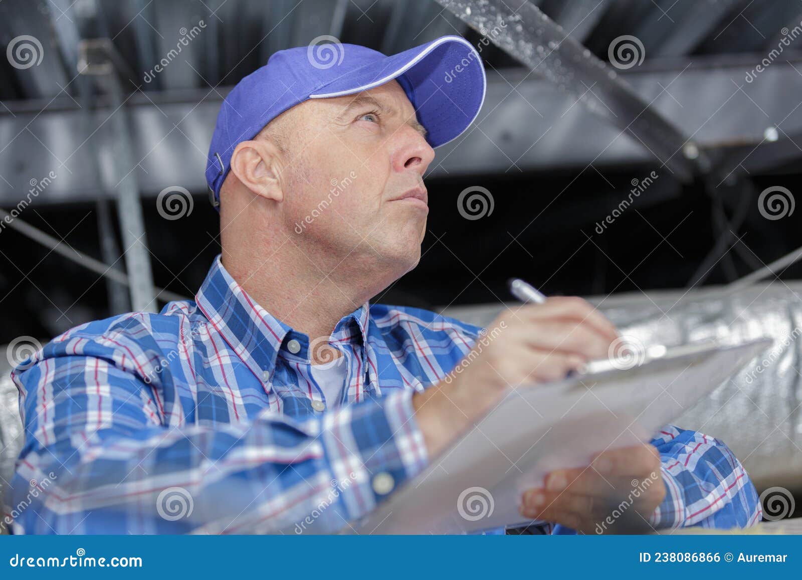 Male Building Inspector Assessing Renovation Project Stock Photo ...