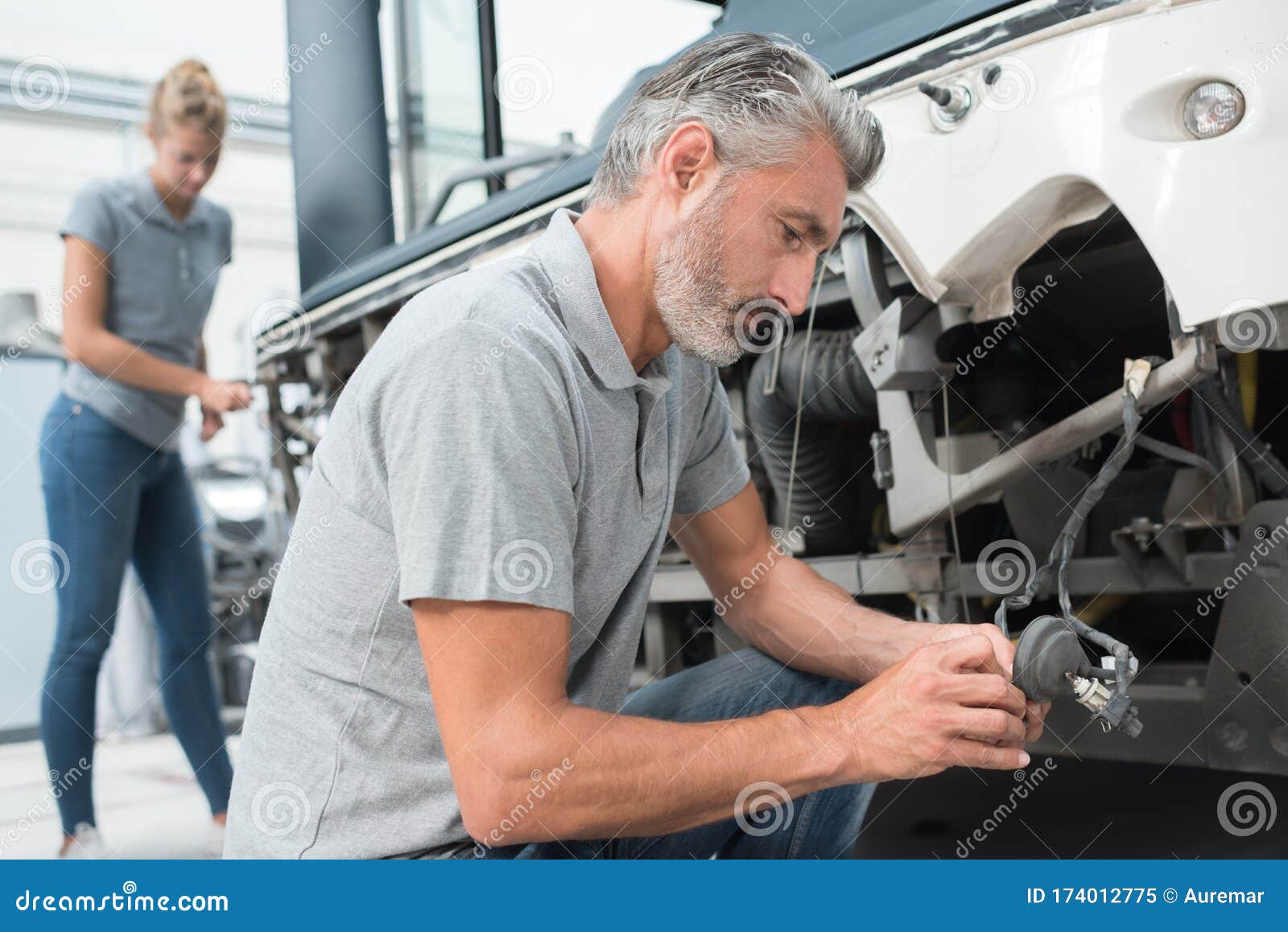 Male bus mechanic at work stock image. Image of replacement - 174012775