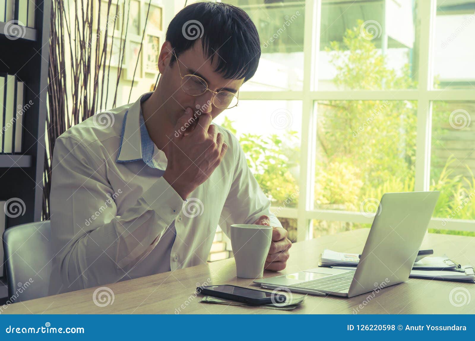 Male Business Man Drinking Coffee while Using Mobile Computer Stock ...