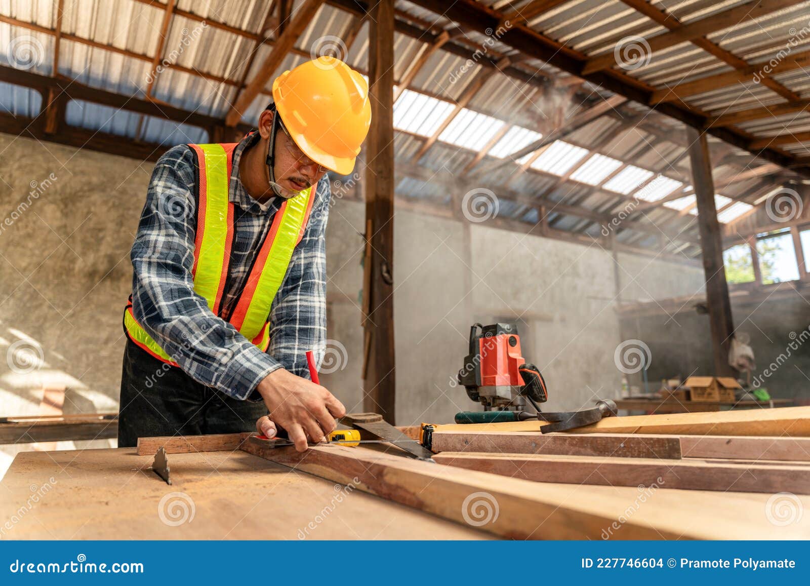 Carpenter Using Nail Gun To Moldings On Windows, Framing Trim, Stock ...