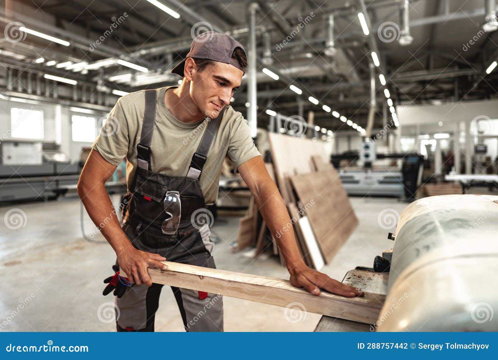 Male Carpenter Using Some Woodworking Tools for His Work in a Factory ...