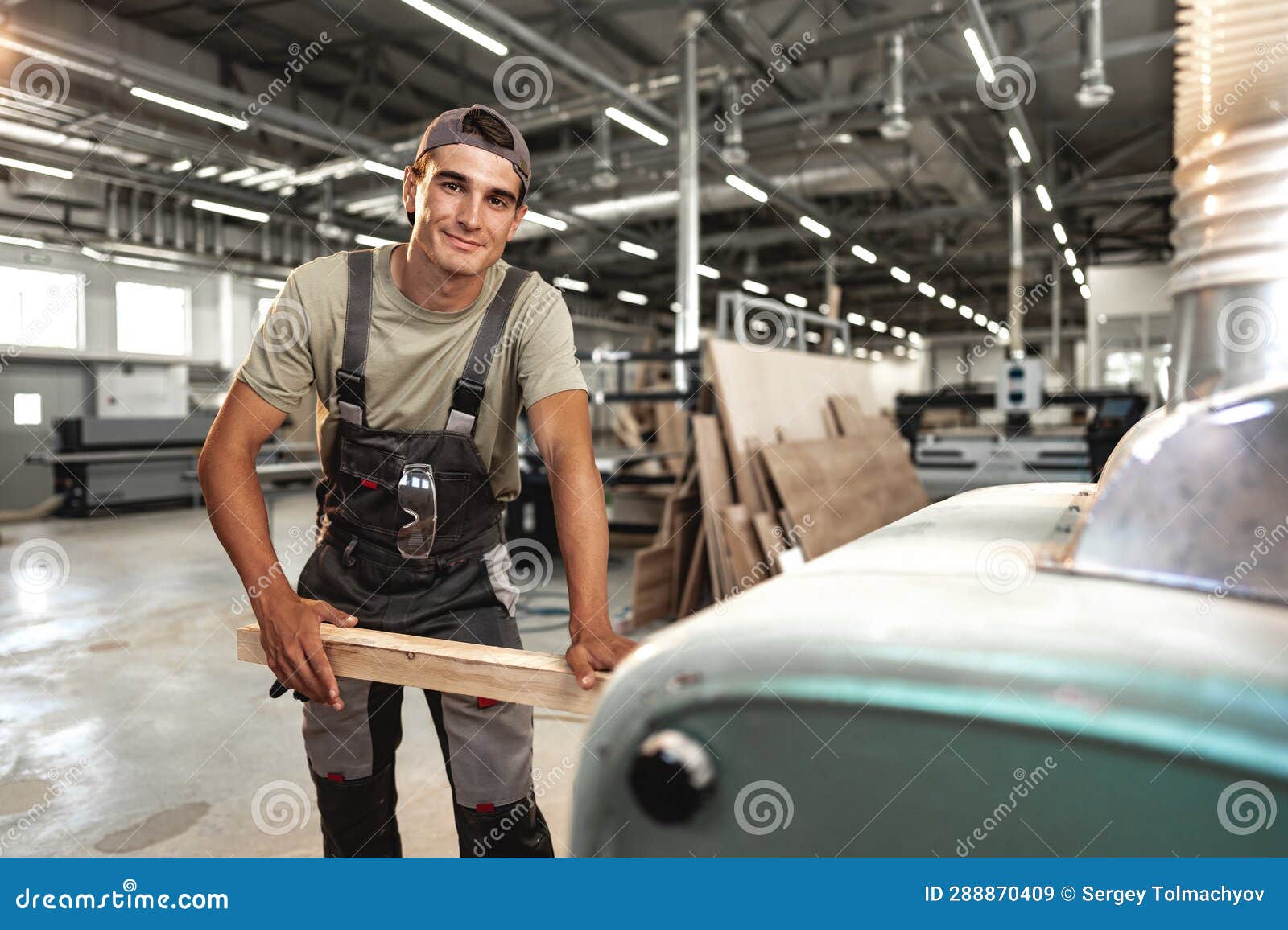Male Carpenter Using Some Woodworking Tools for His Work in a Factory ...