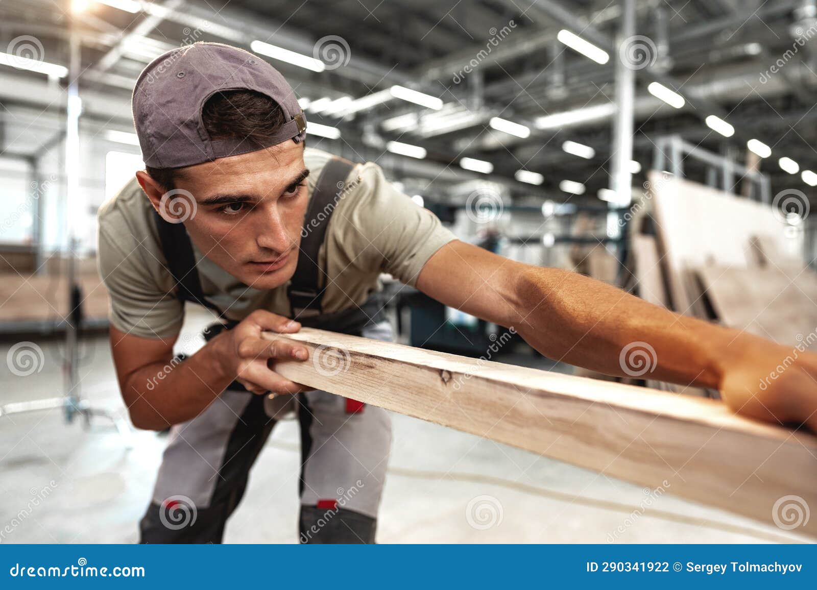 Male Carpenter Using Some Woodworking Tools for His Work in a Factory ...