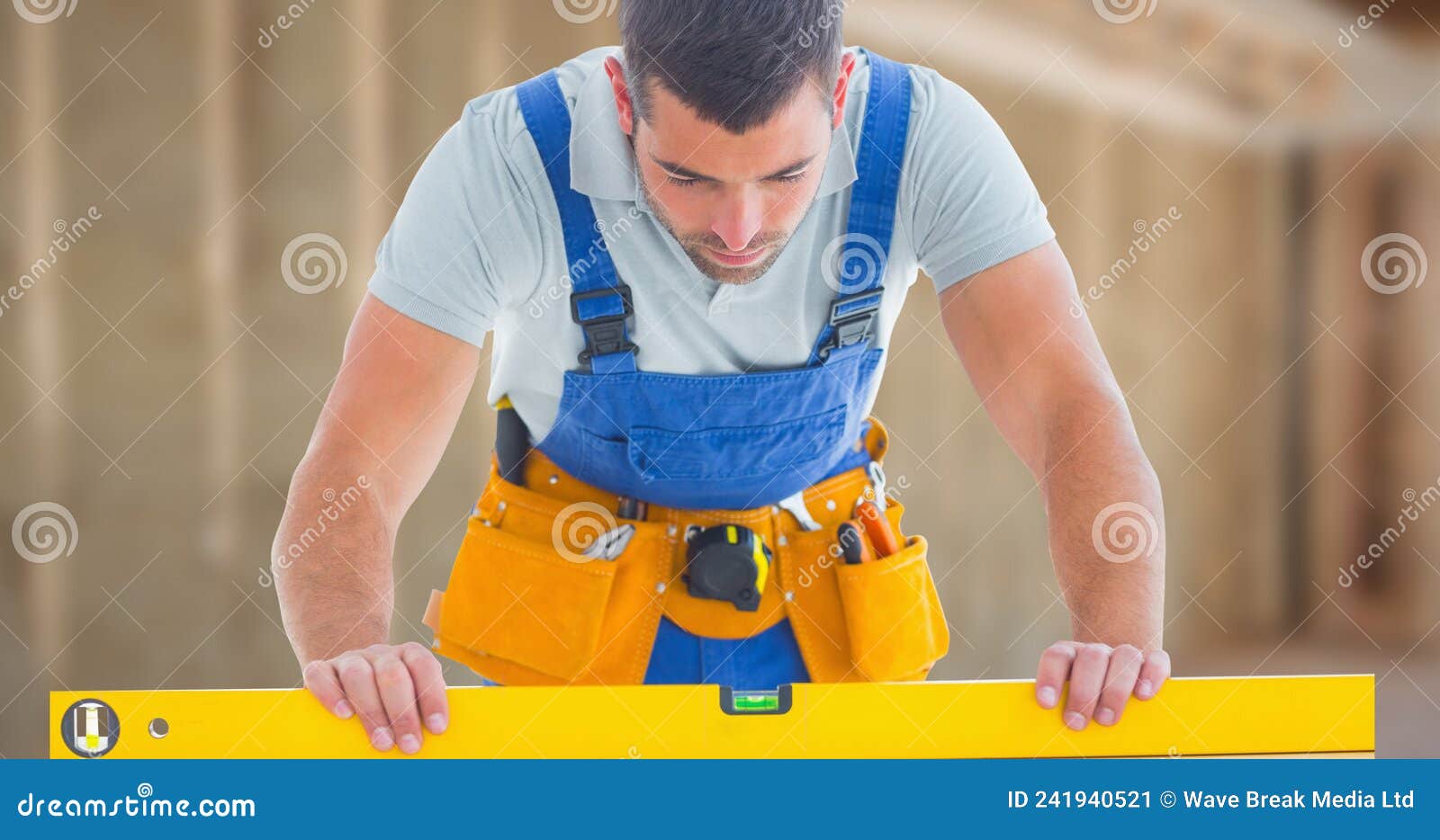 Male Caucasian Construction Worker Using Level while Working at Side ...