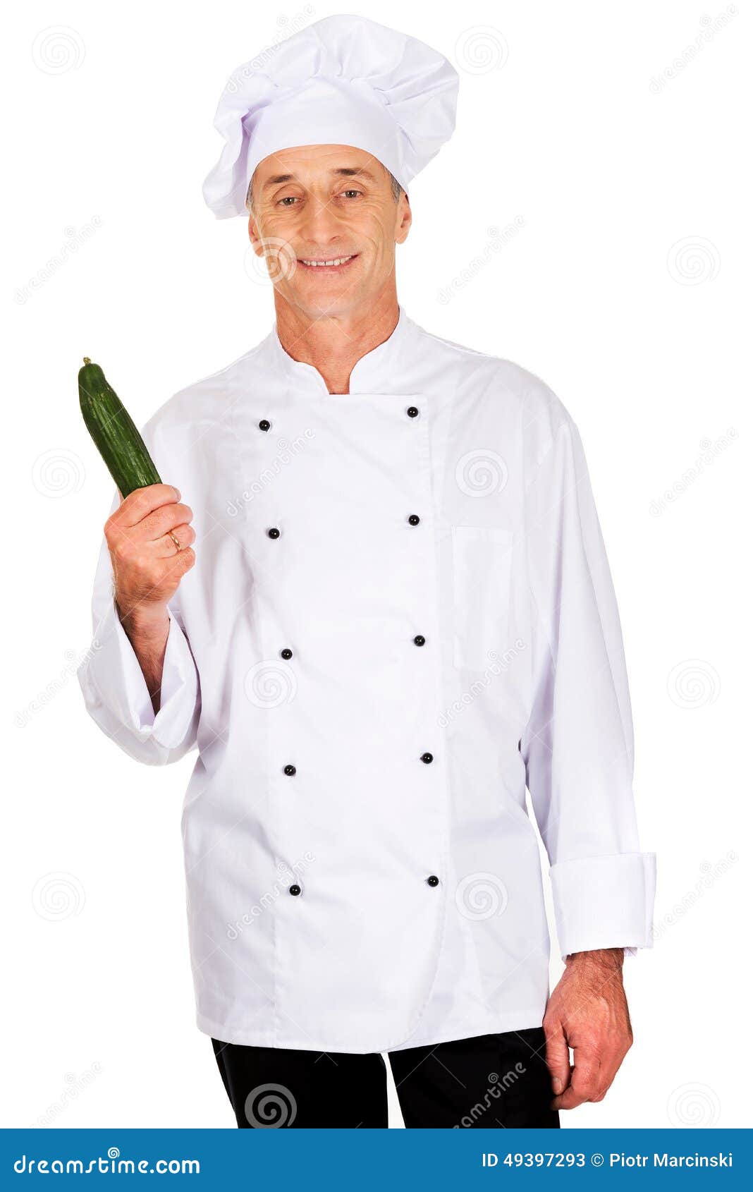Male chef with a cucumber stock image. Image of service - 49397293