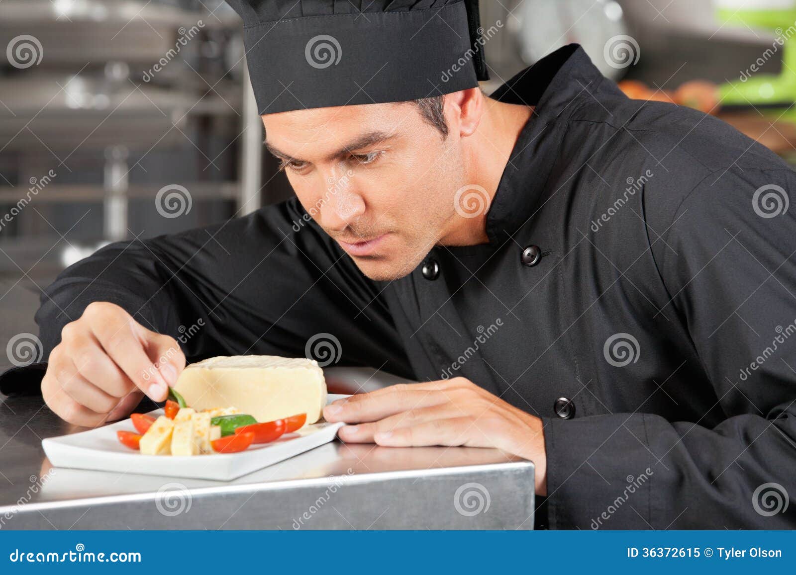 Male Chef Garnishing Dish stock image. Image of gourmet - 36372615
