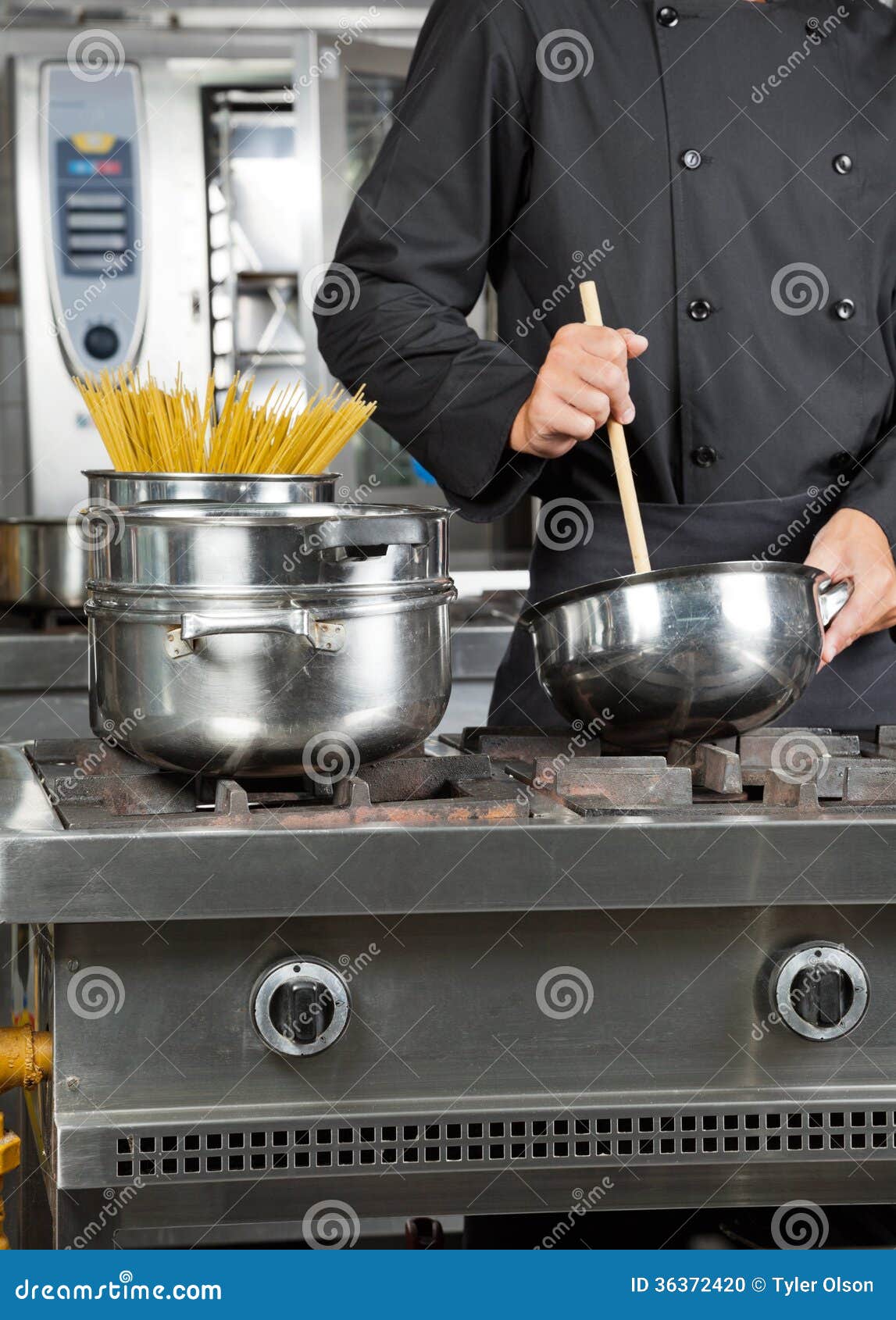 Male Chef Preparing Spaghetti Stock Photo - Image of person, chef: 36372420
