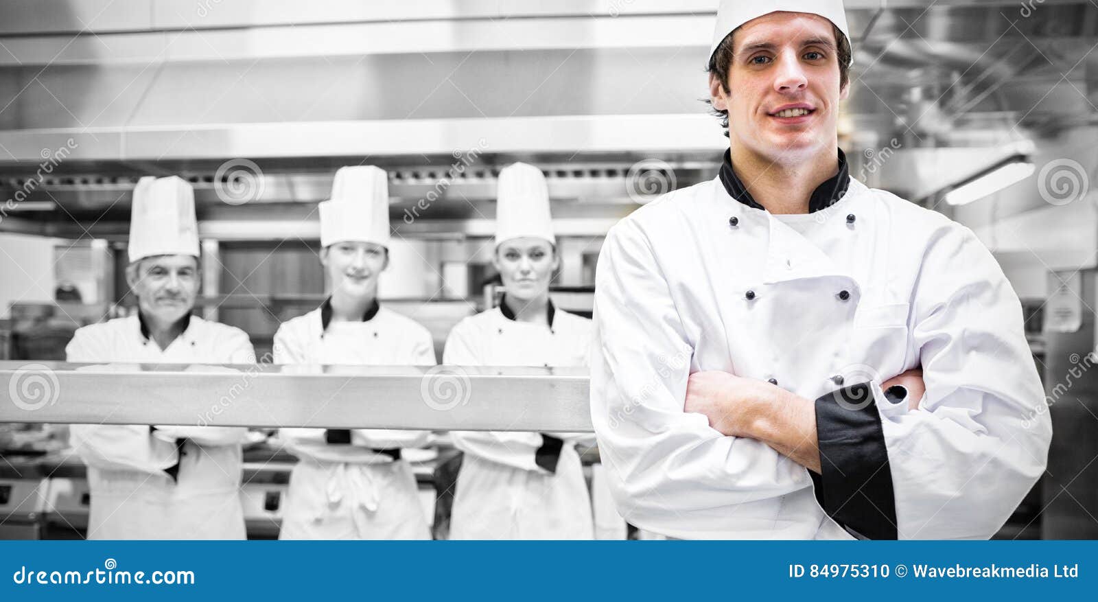 Male Chef Standing in Kitchen Stock Photo - Image of affection, female ...