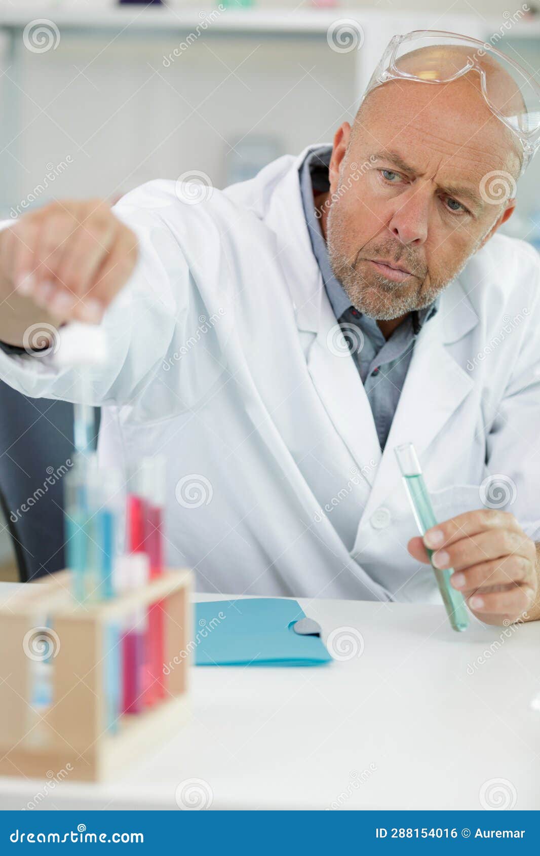 Male Chemist with Liquid Sample in Front Laboratory Stock Photo - Image ...