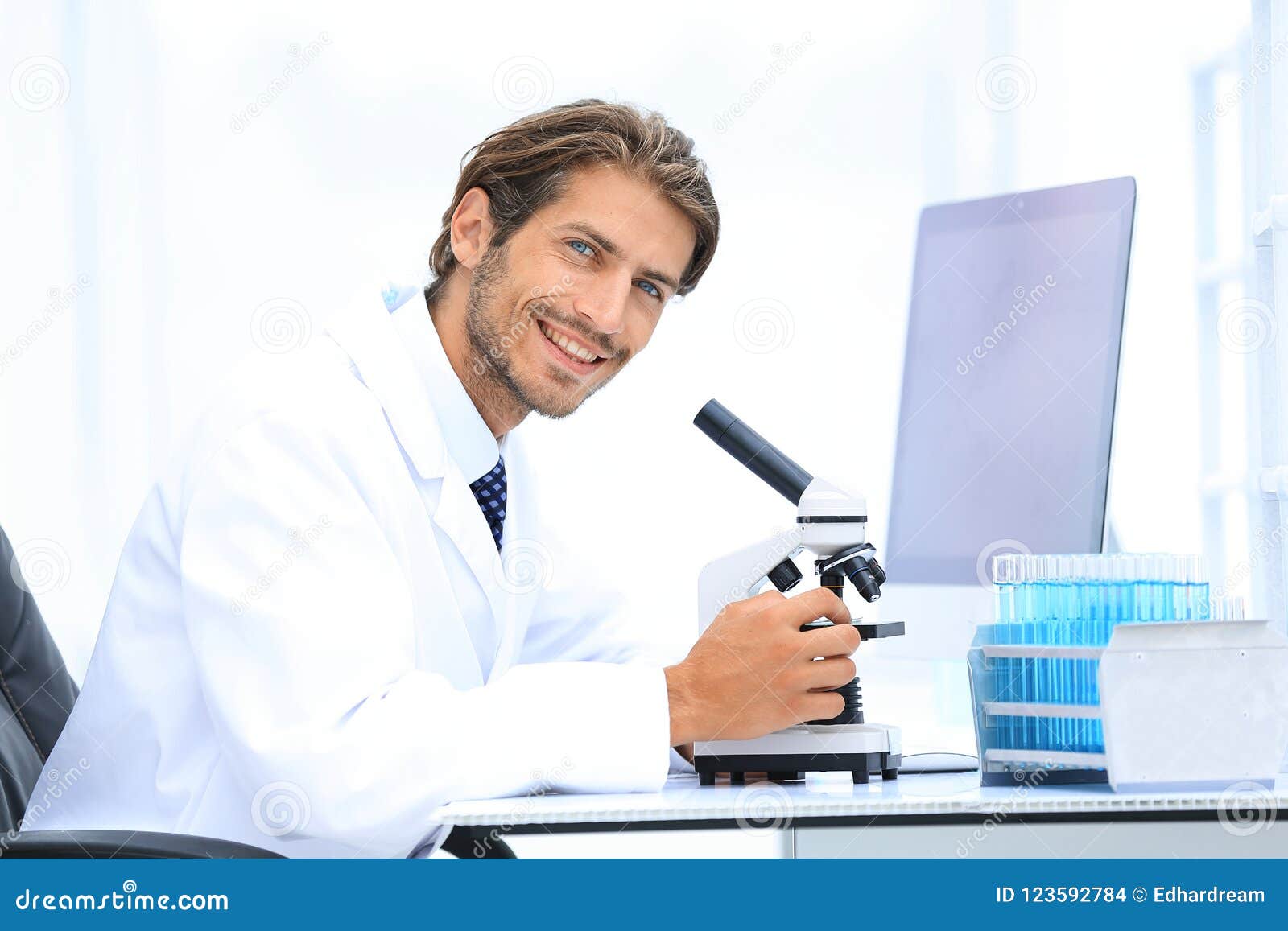 Male Chemist Scientific Reseacher Using Microscope in Laboratory Stock ...
