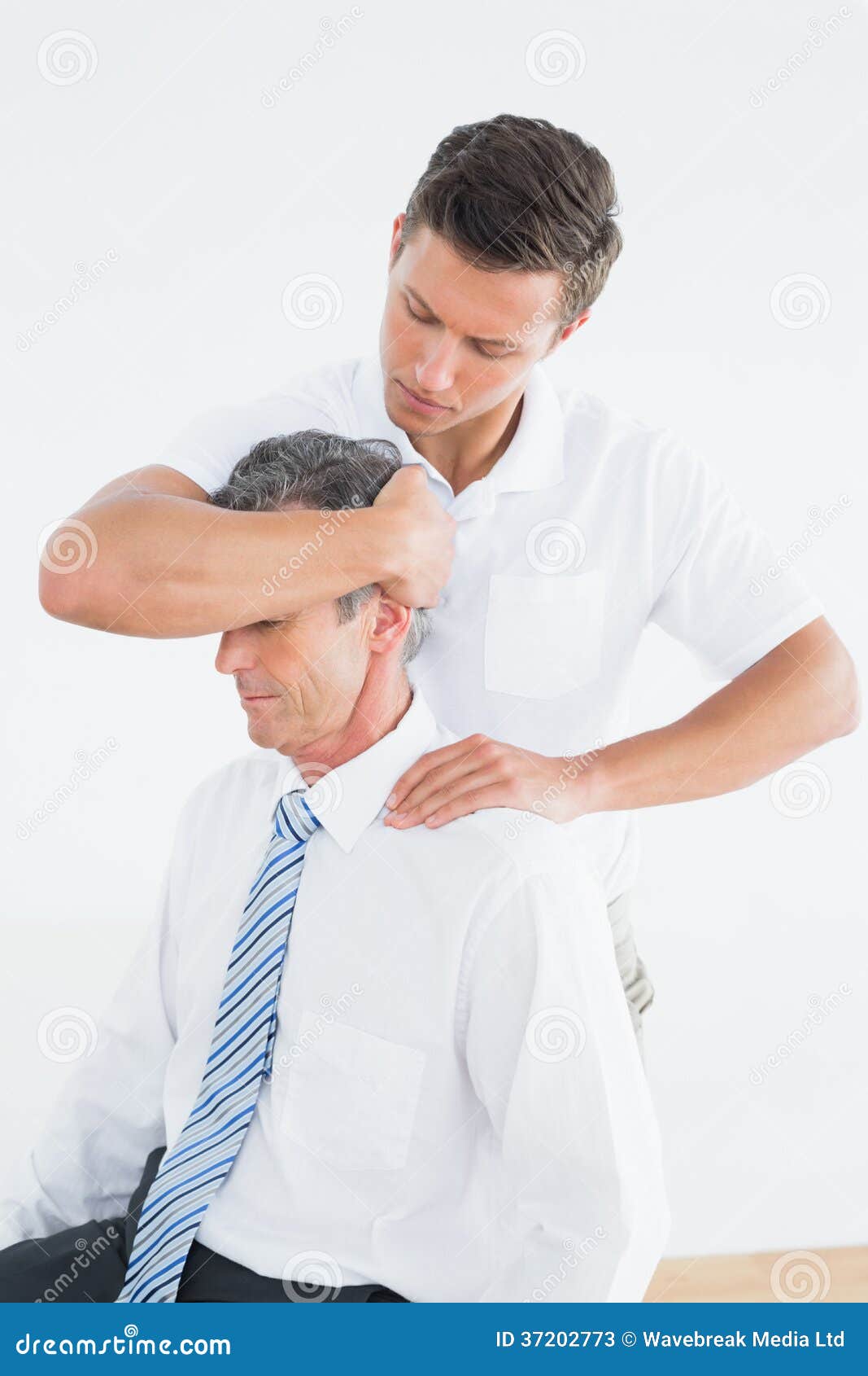 Male Chiropractor Doing Neck Adjustment Stock Image - Image of ...
